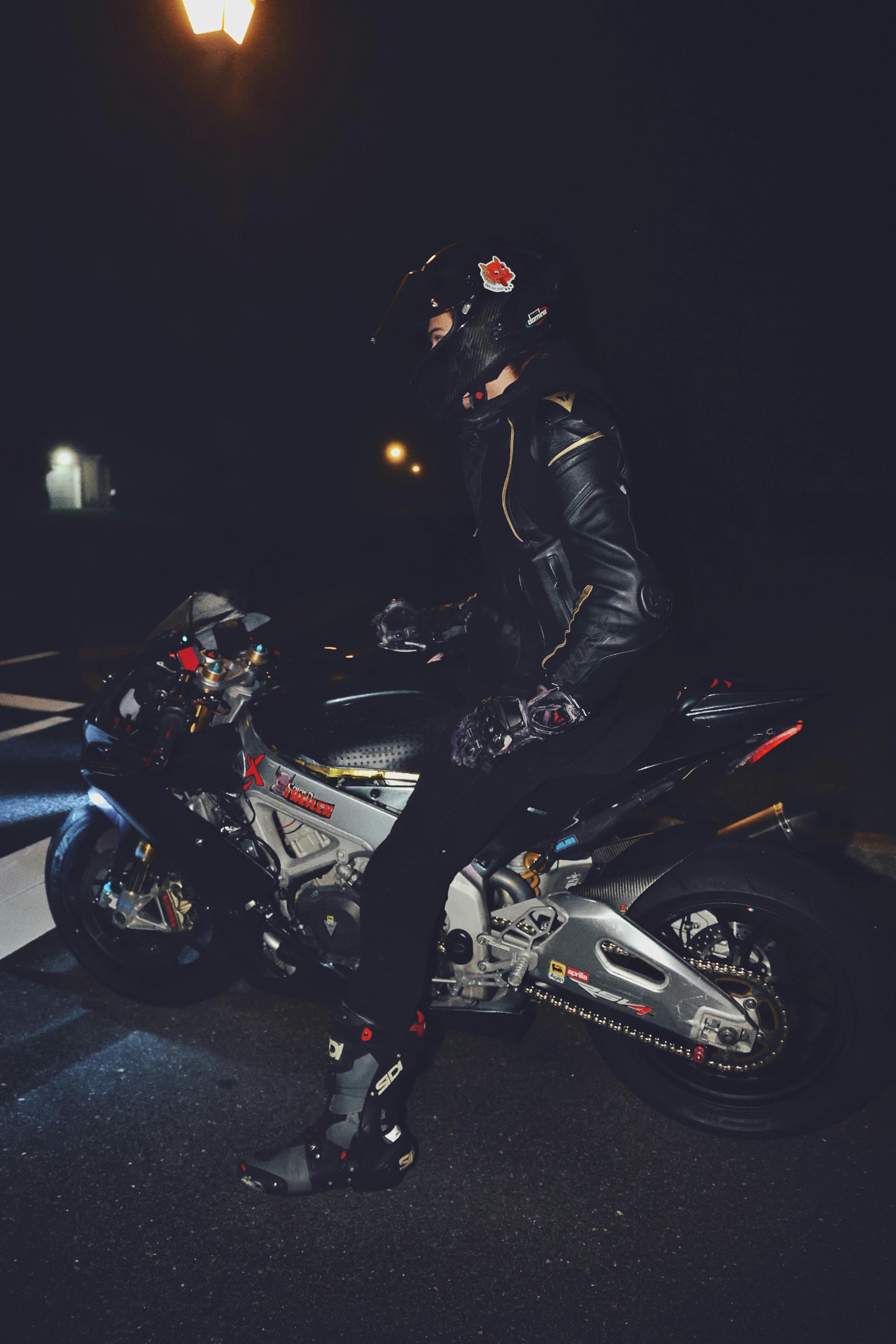 Person Riding Black Motorcycle on the Forest Road · Free Stock Photo