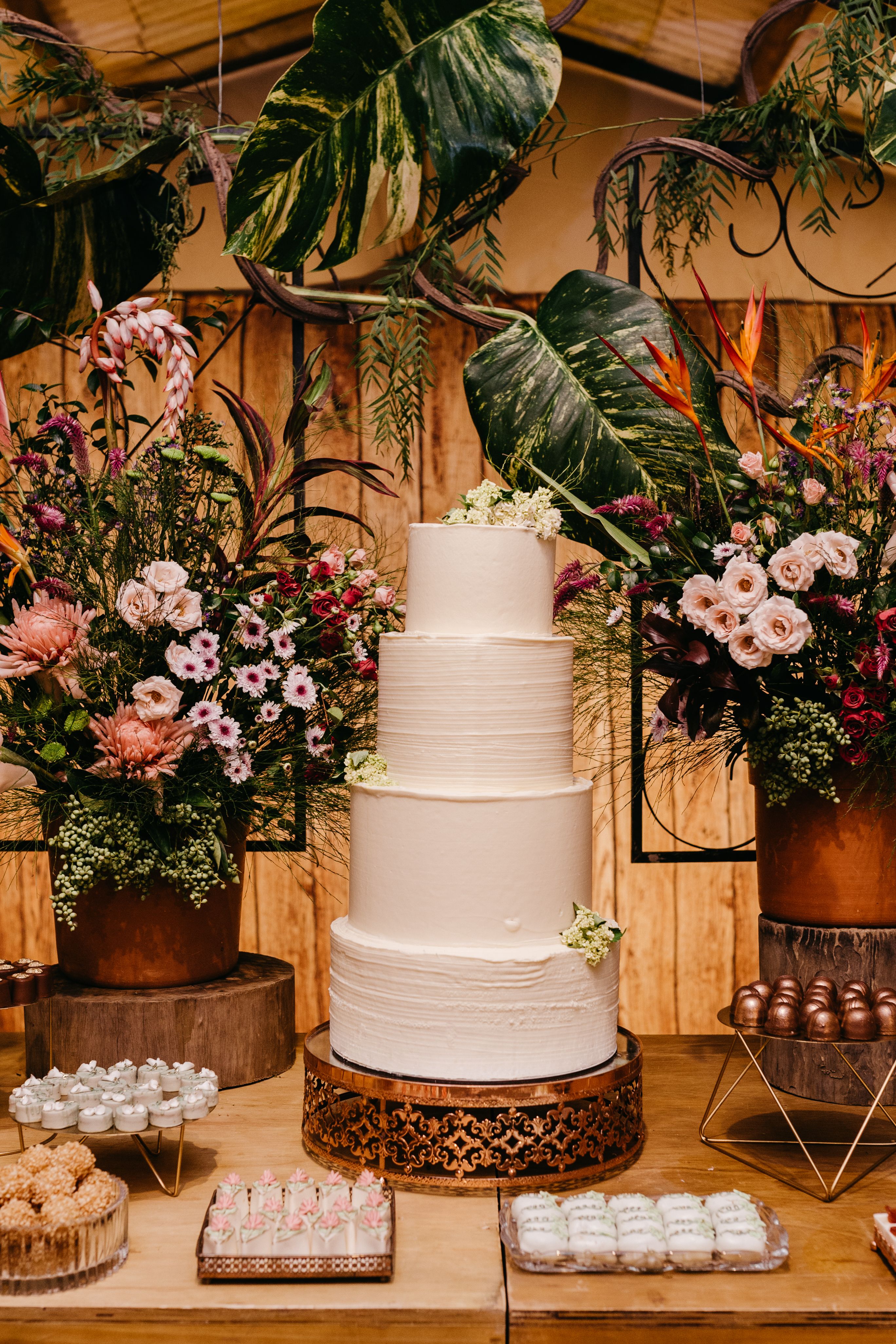 Black Round Cake With Gold Details On Brown Wooden Table · Free Stock Photo