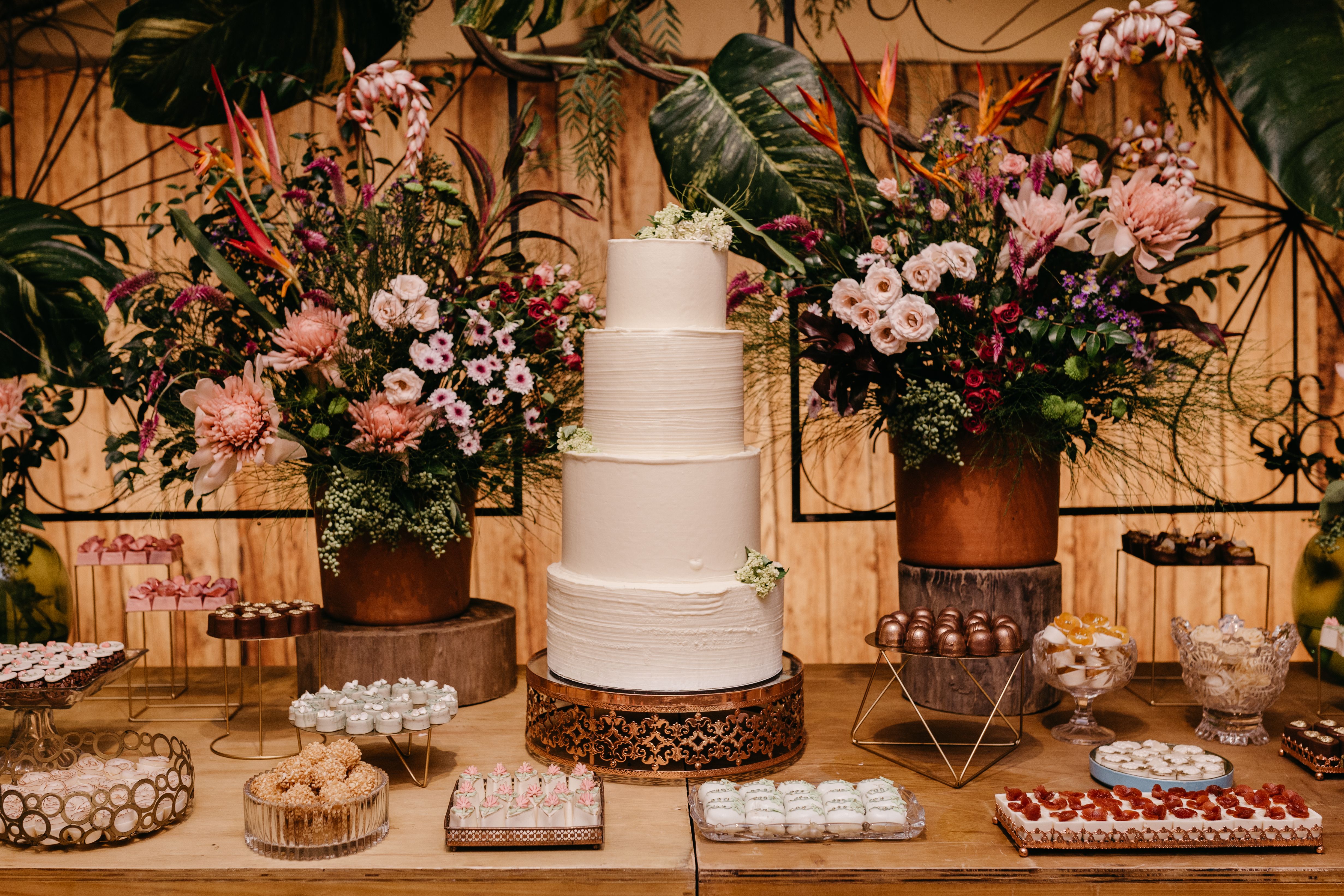 Black Round Cake With Gold Details On Brown Wooden Table · Free Stock Photo