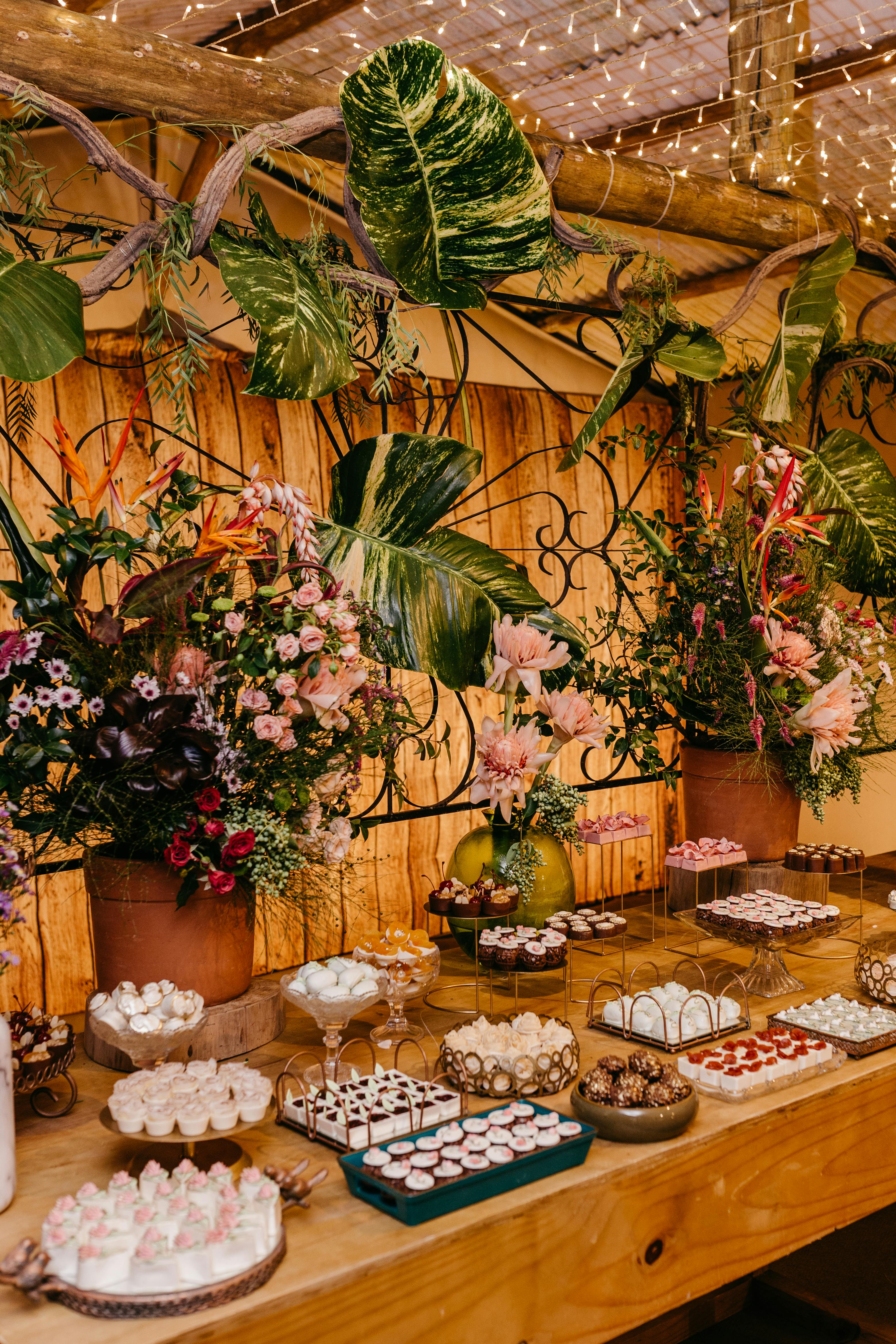 Flowers and Desserts on Top of a Table · Free Stock Photo