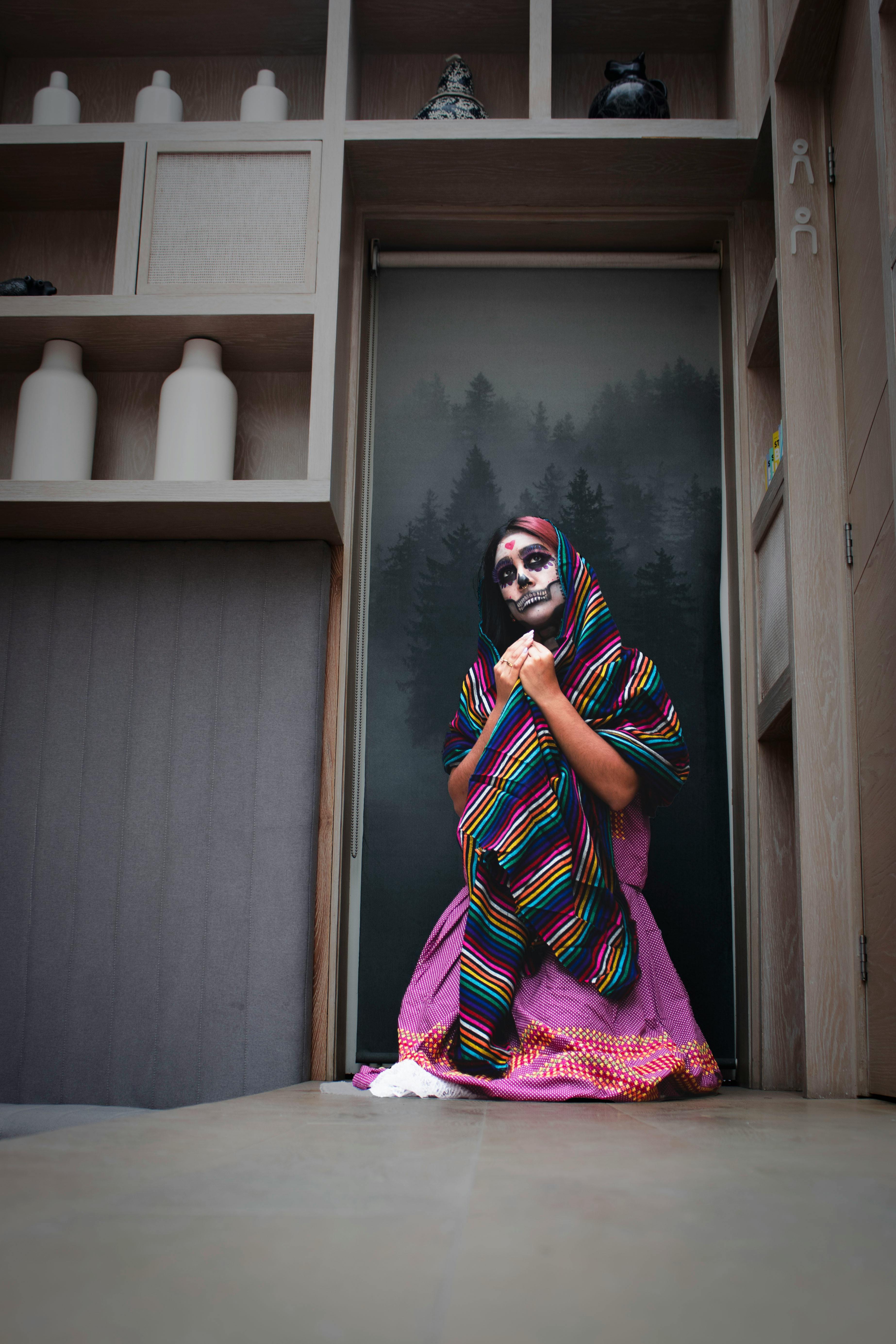 Woman in Santa Muerte Costume Holding Smoking Skull · Free Stock Photo