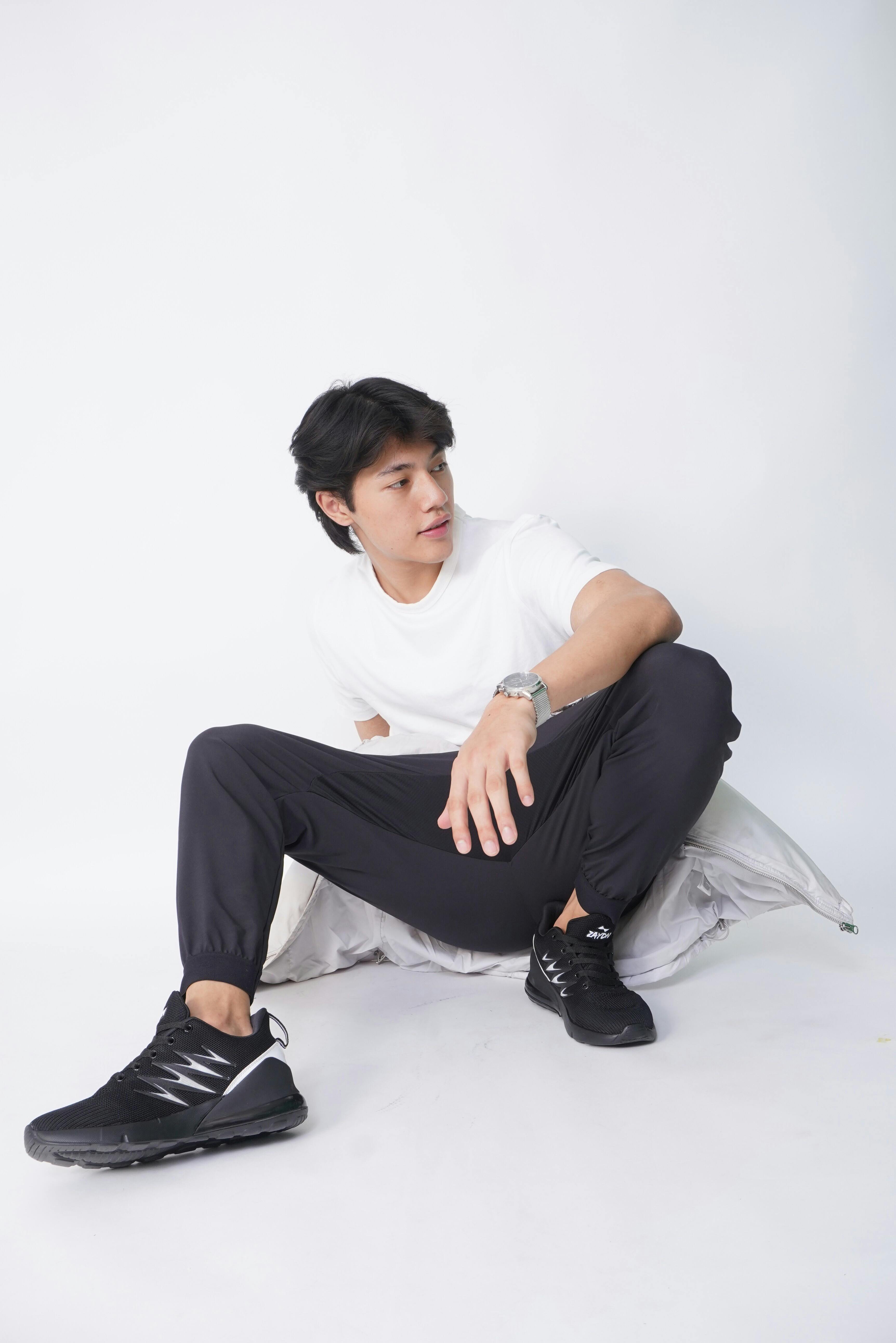 Man Sitting on Chair and Posing · Free Stock Photo