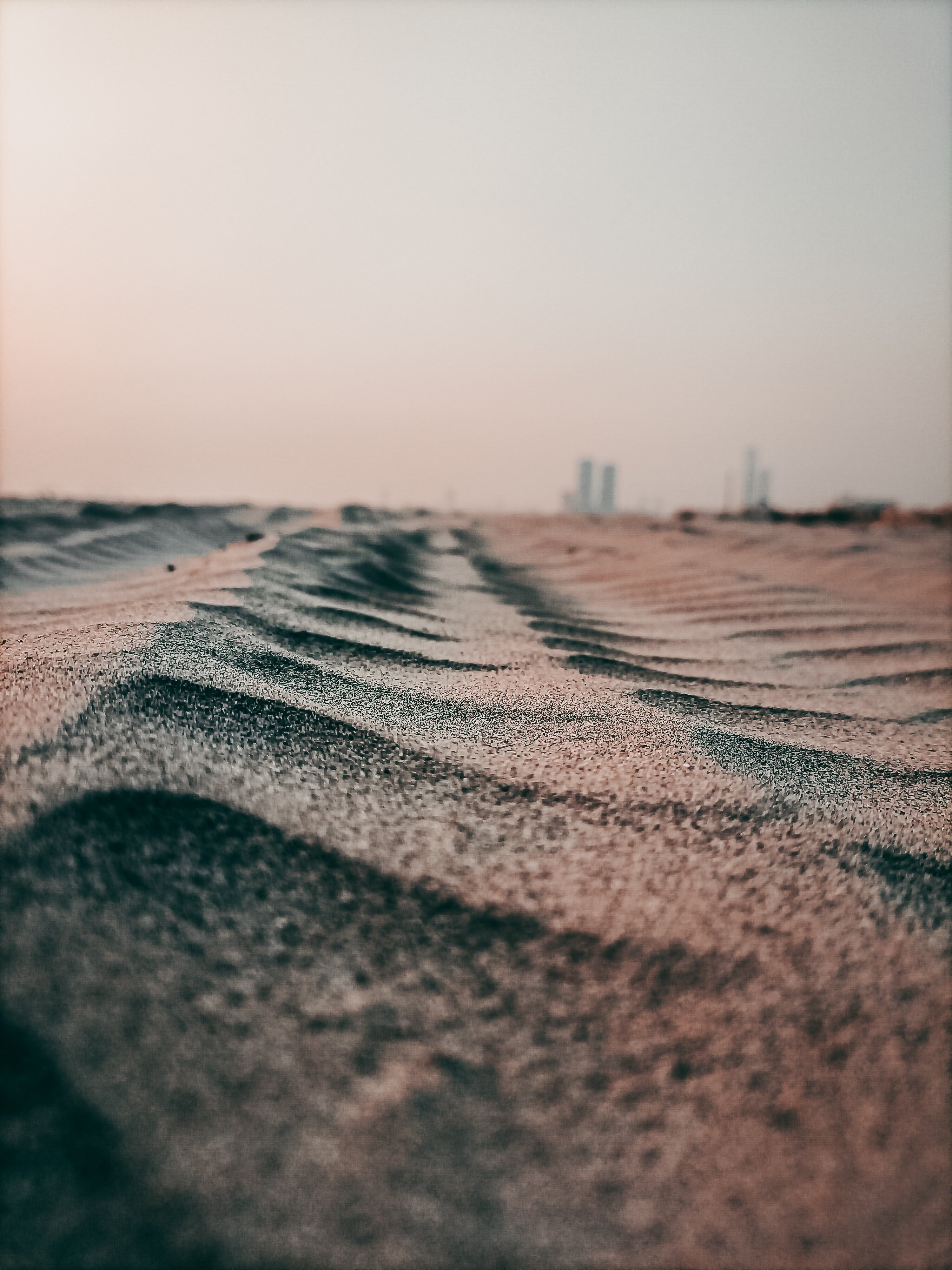 Close-up of a Barren Land with City in the Distance · Free Stock Photo