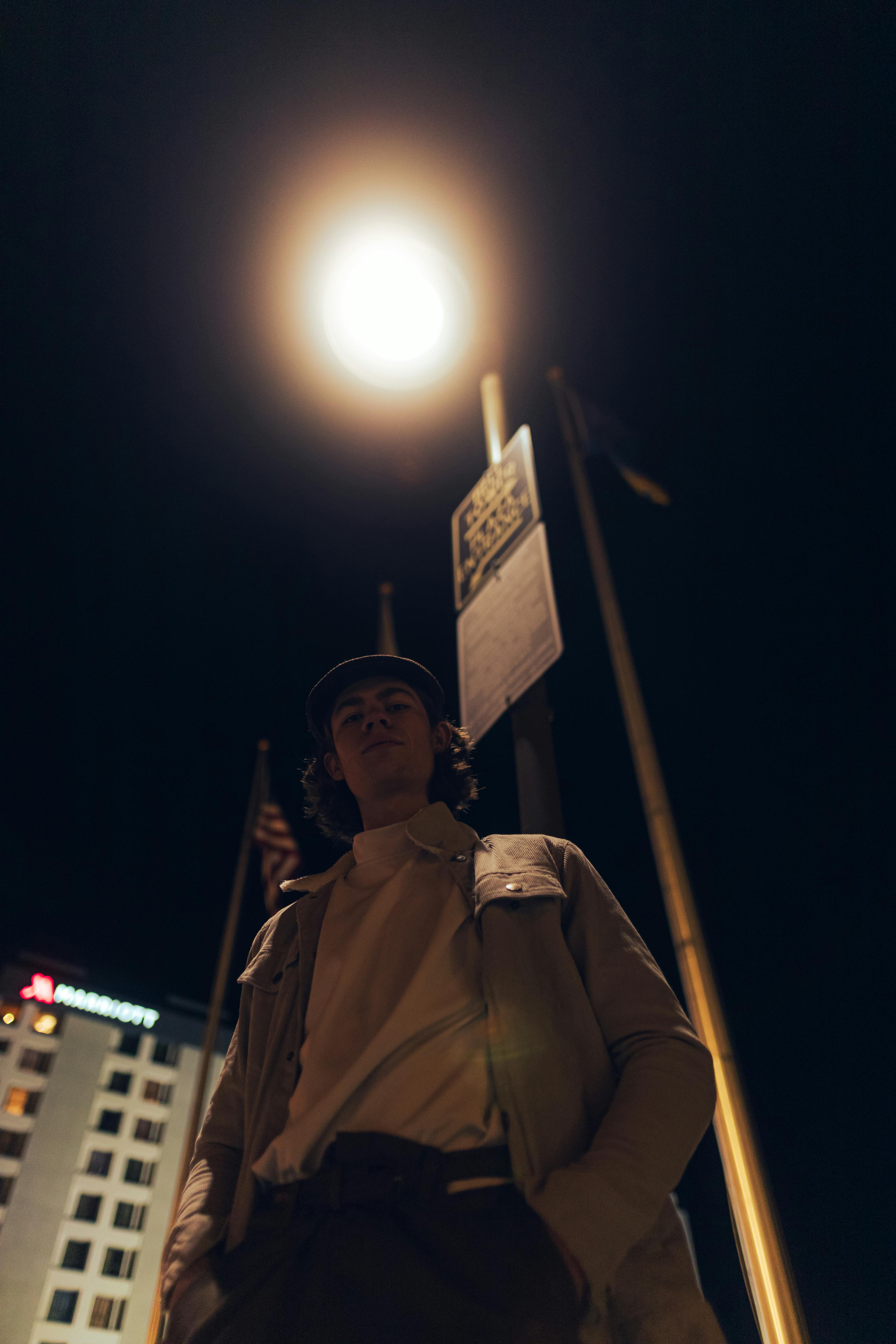 A Man Standing Under the Streetlight · Free Stock Photo