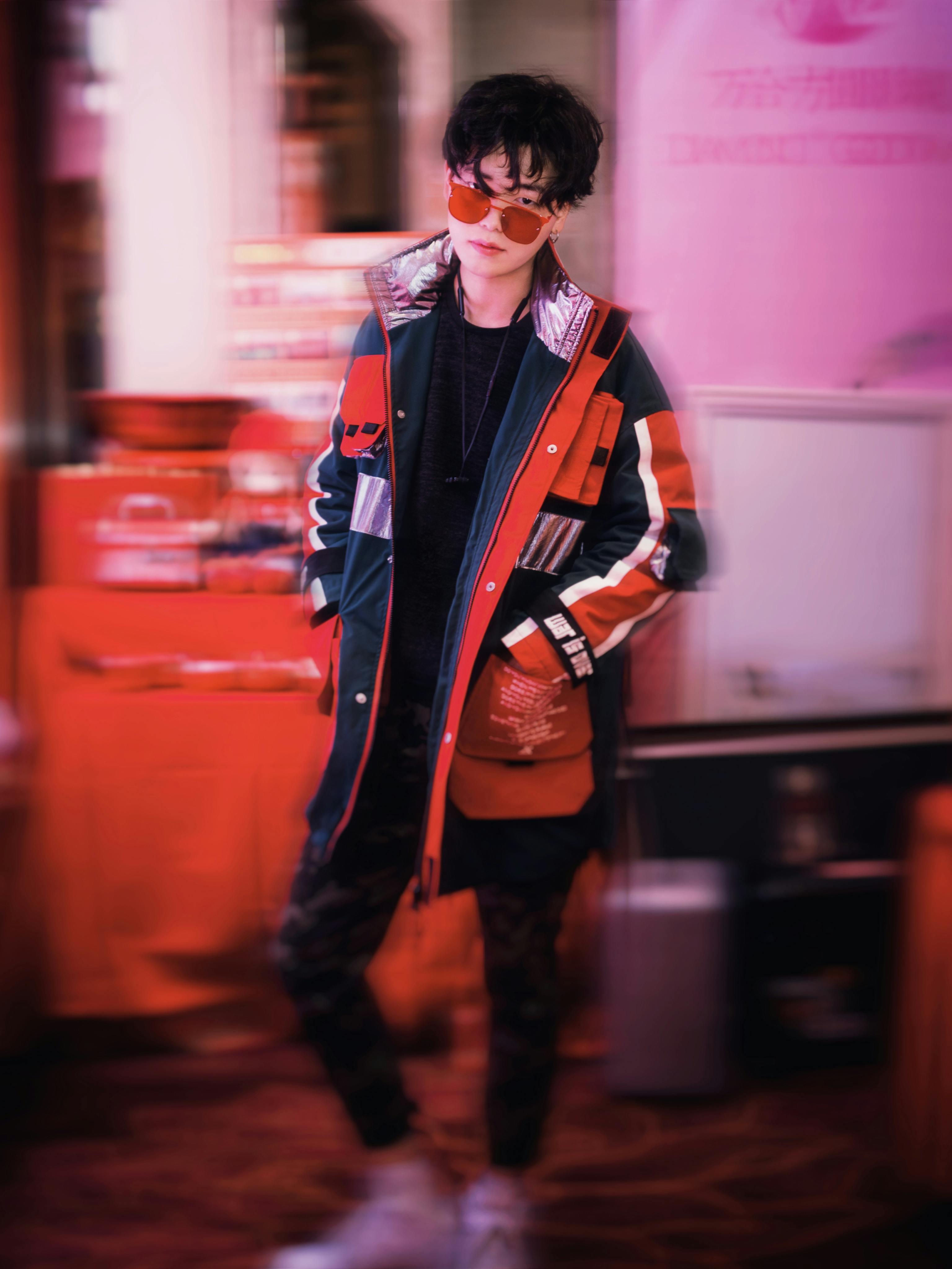 A Man in Red and Blue Jacket Posing at the Camera · Free Stock Photo