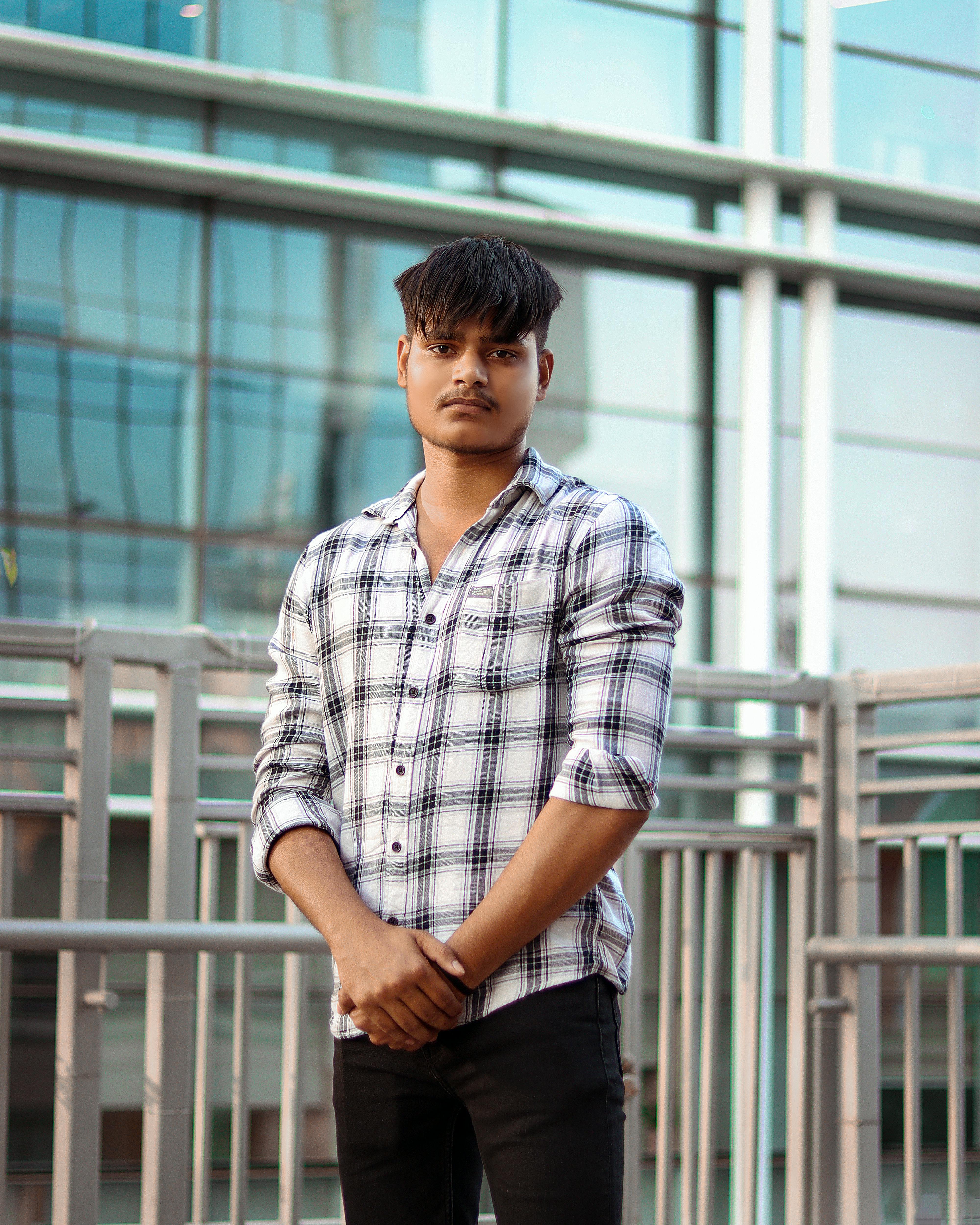 Man in Checkered Long Sleeve Shirt Smiling · Free Stock Photo