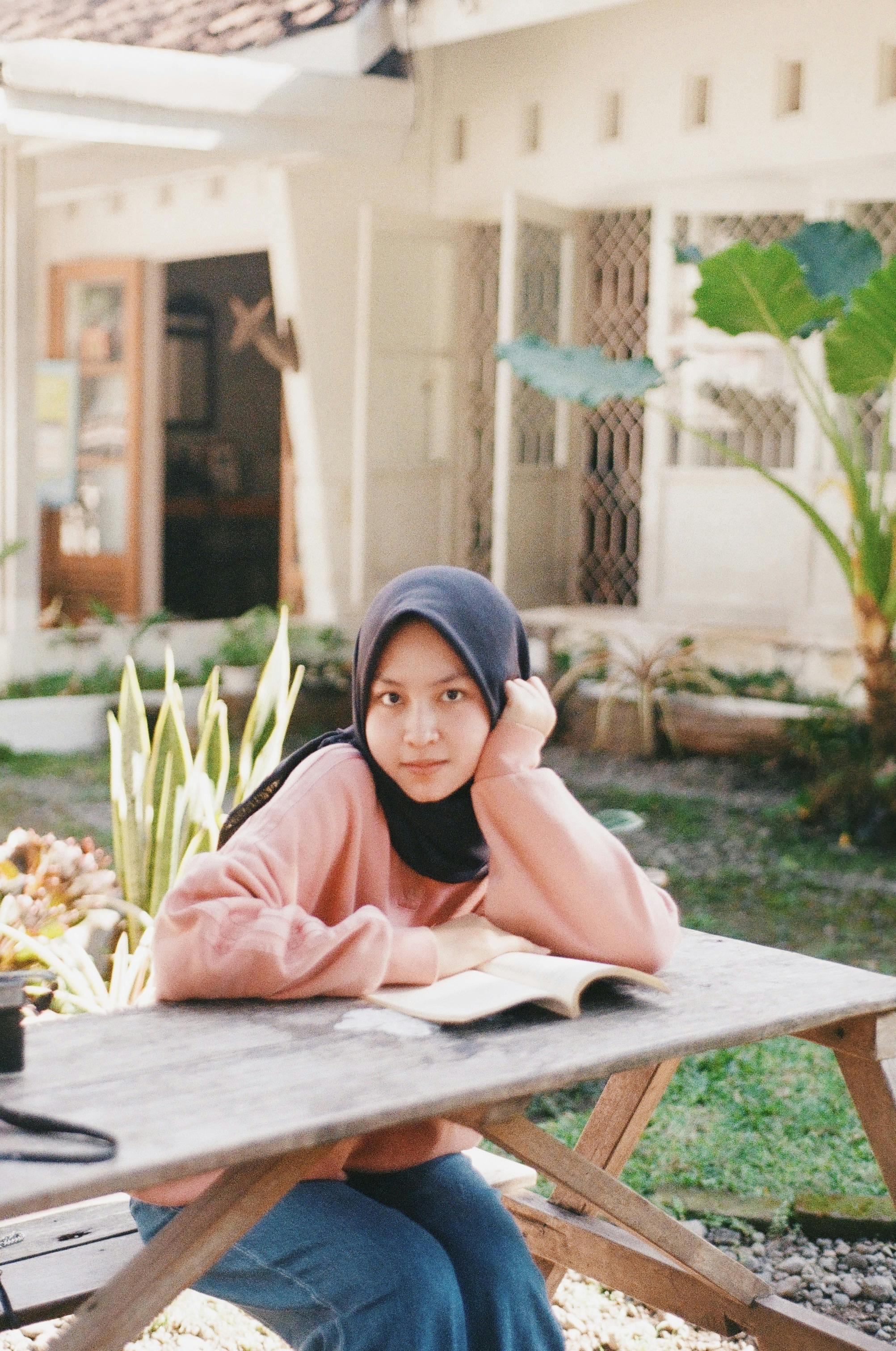 Woman in Black Hijab Holding a Vape · Free Stock Photo