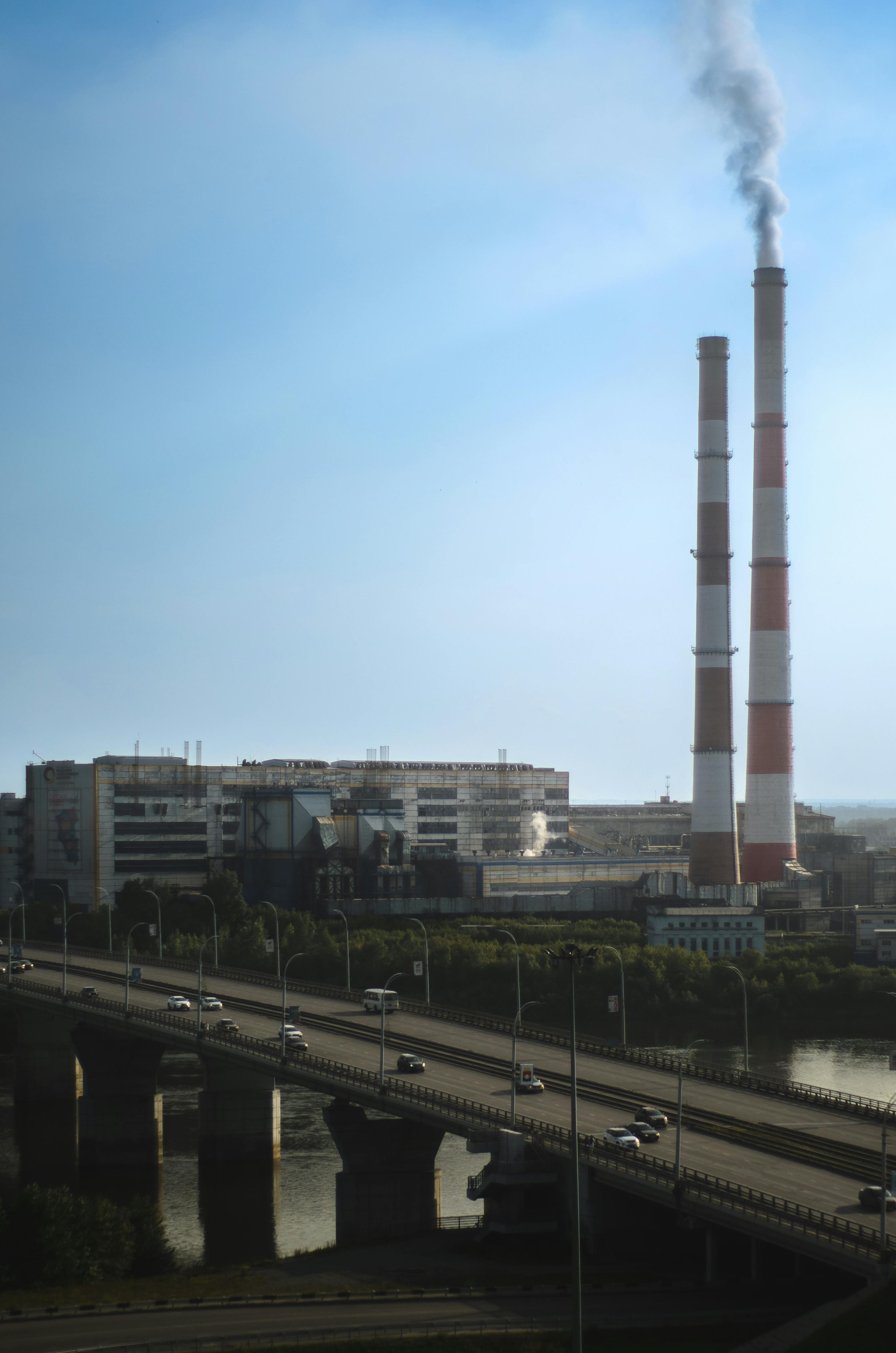 Smoke Stacks Against Blue Sky · Free Stock Photo