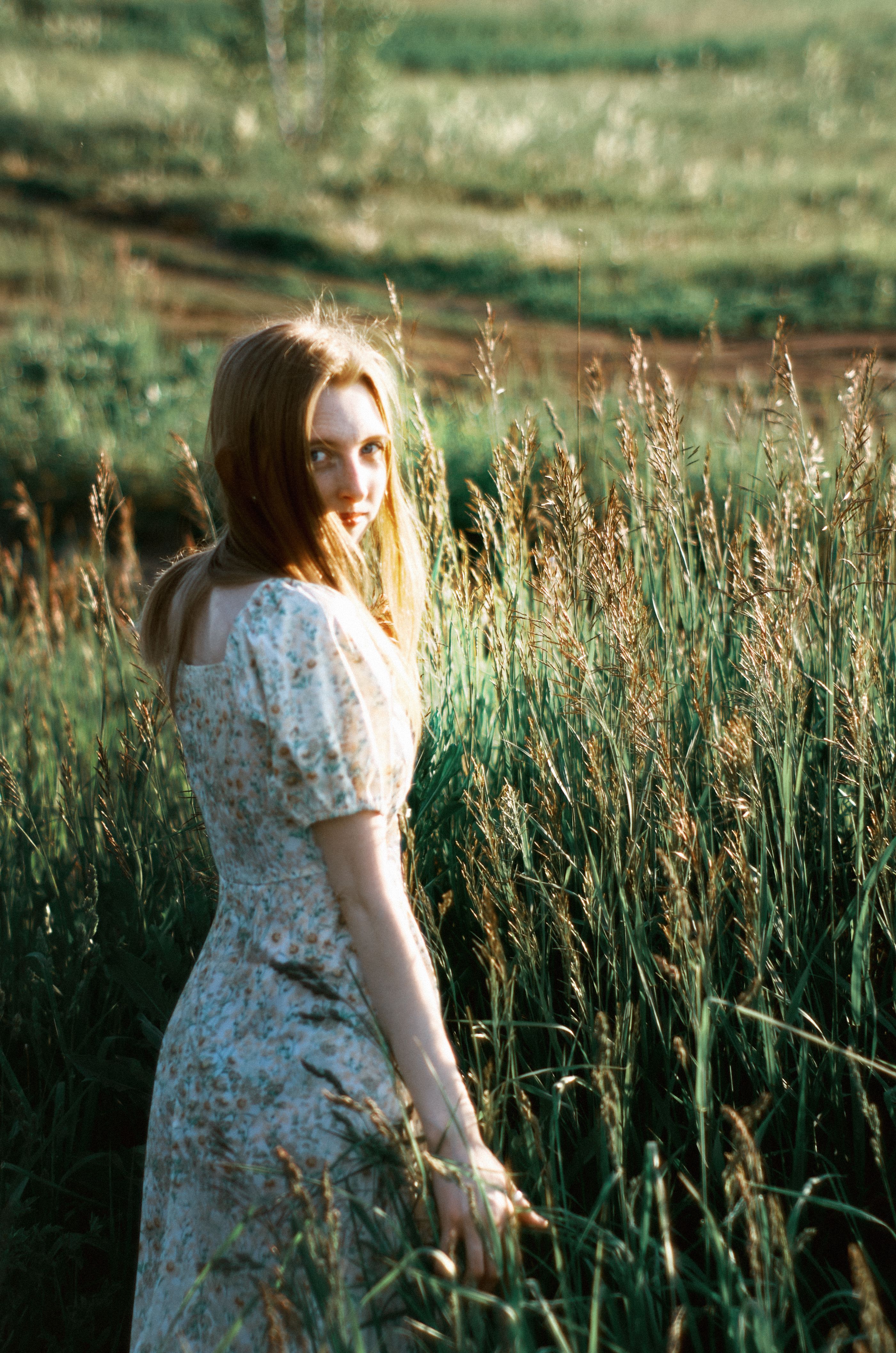 A Woman in Black Bralette Sitting while Wearing Floral Cardigan · Free ...