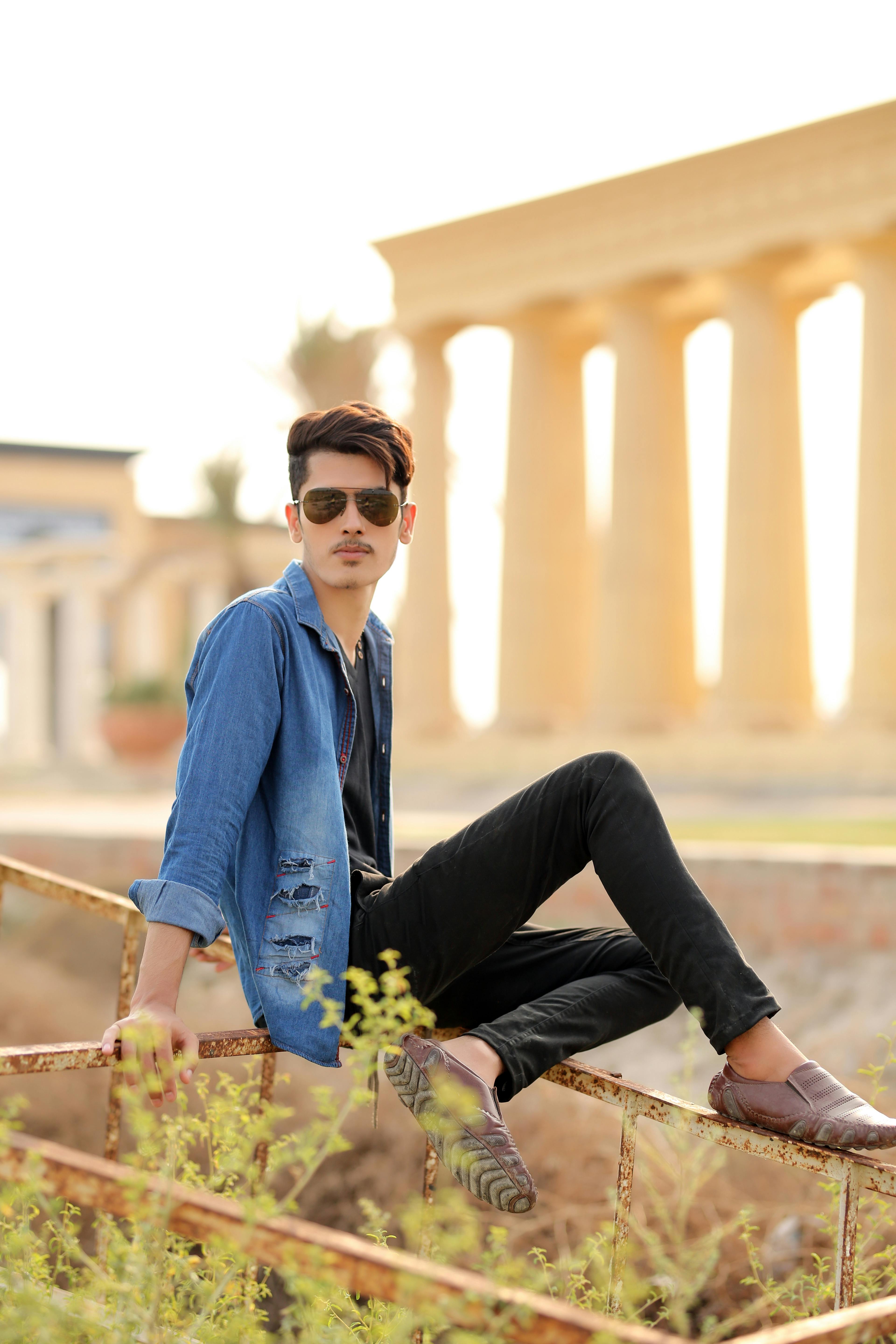 Man in Sunglasses Posing Outdoors near Pillars · Free Stock Photo
