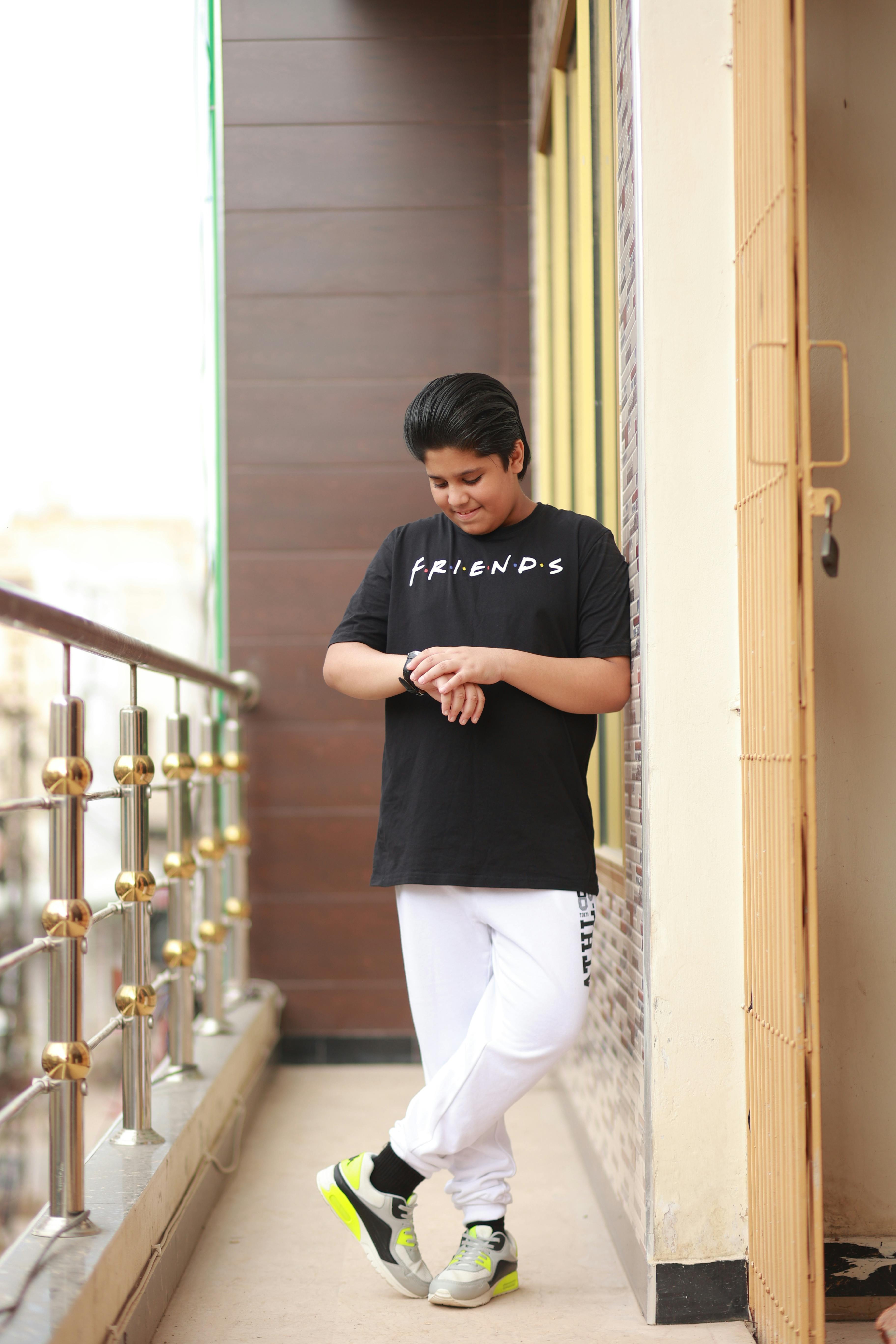 Person in Black Shirt Holding 'We are Free' Sign Behind Red and White ...