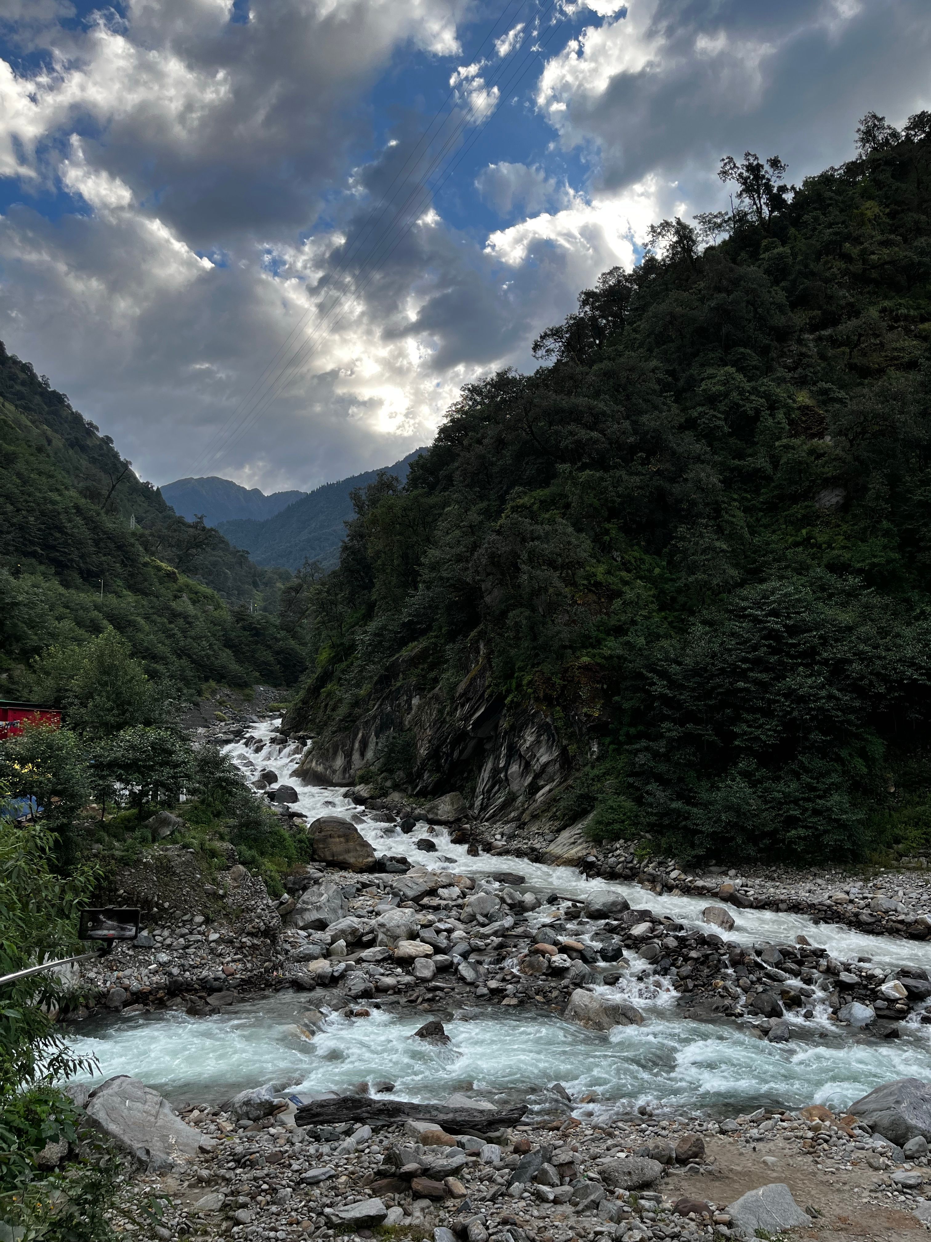 Grayscale Photo of River in Between Mountains · Free Stock Photo