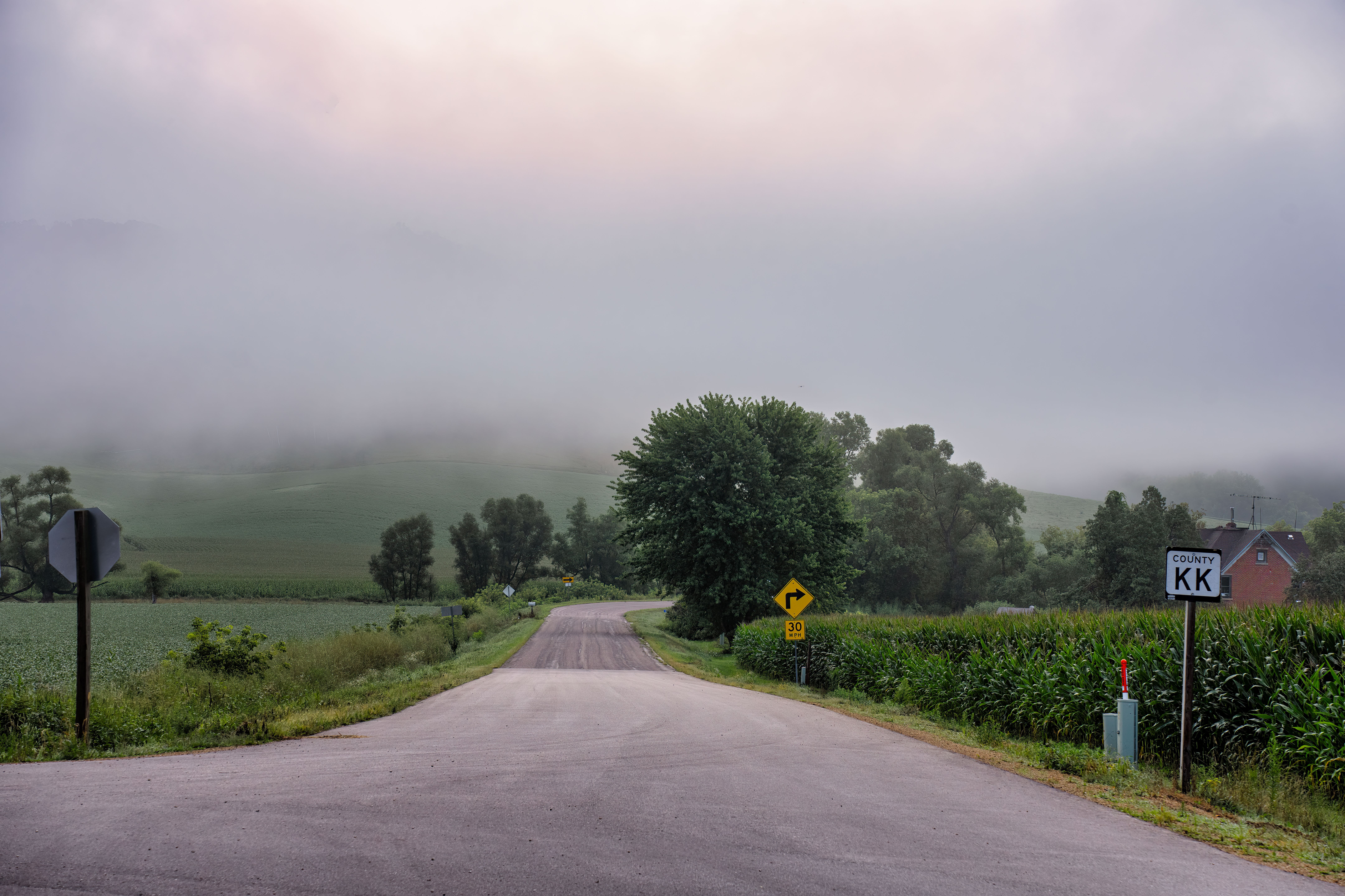 A Gray Concrete Road Under Foggy Sky · Free Stock Photo