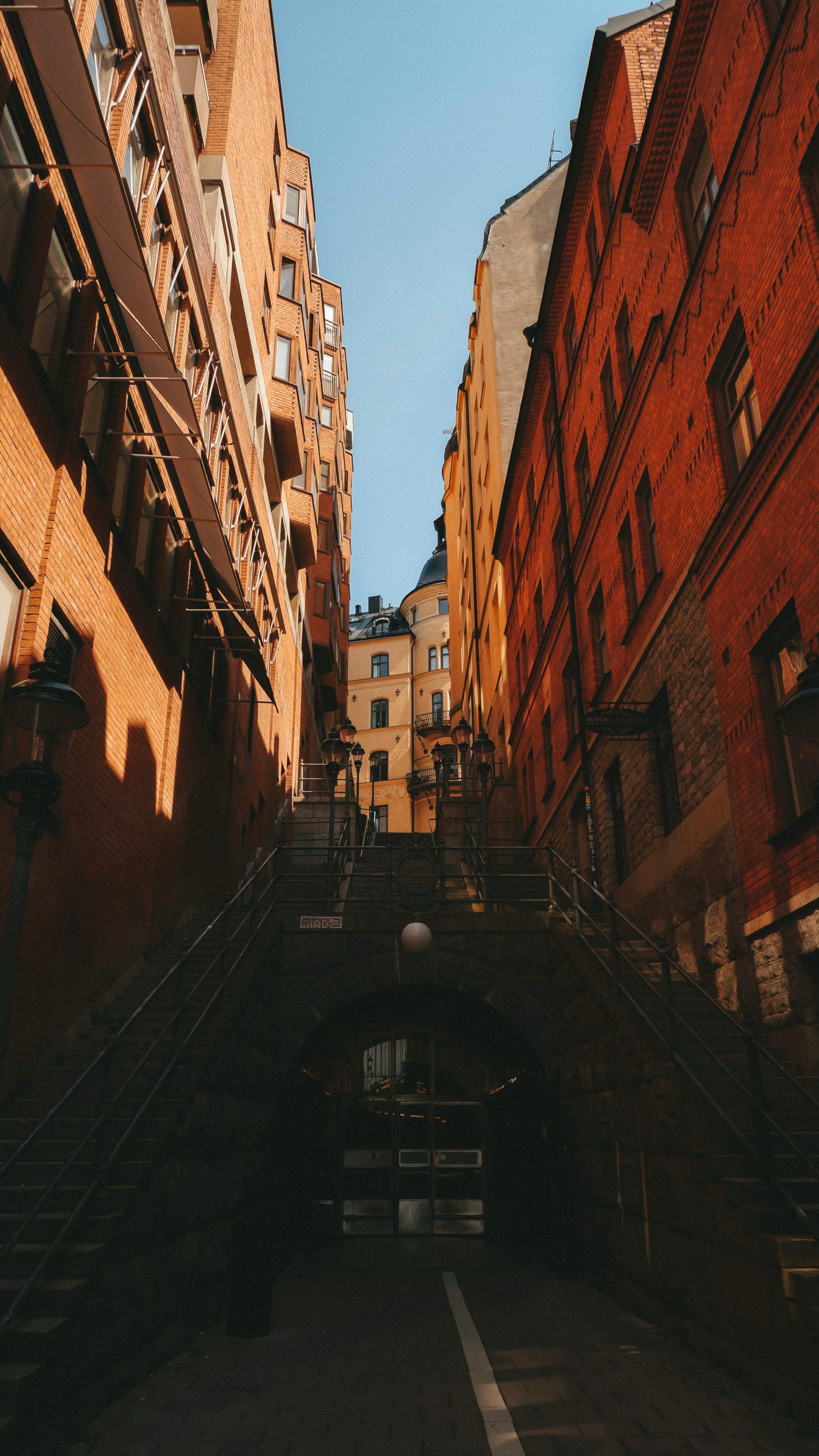 Stairs between Buildings in Shadow · Free Stock Photo