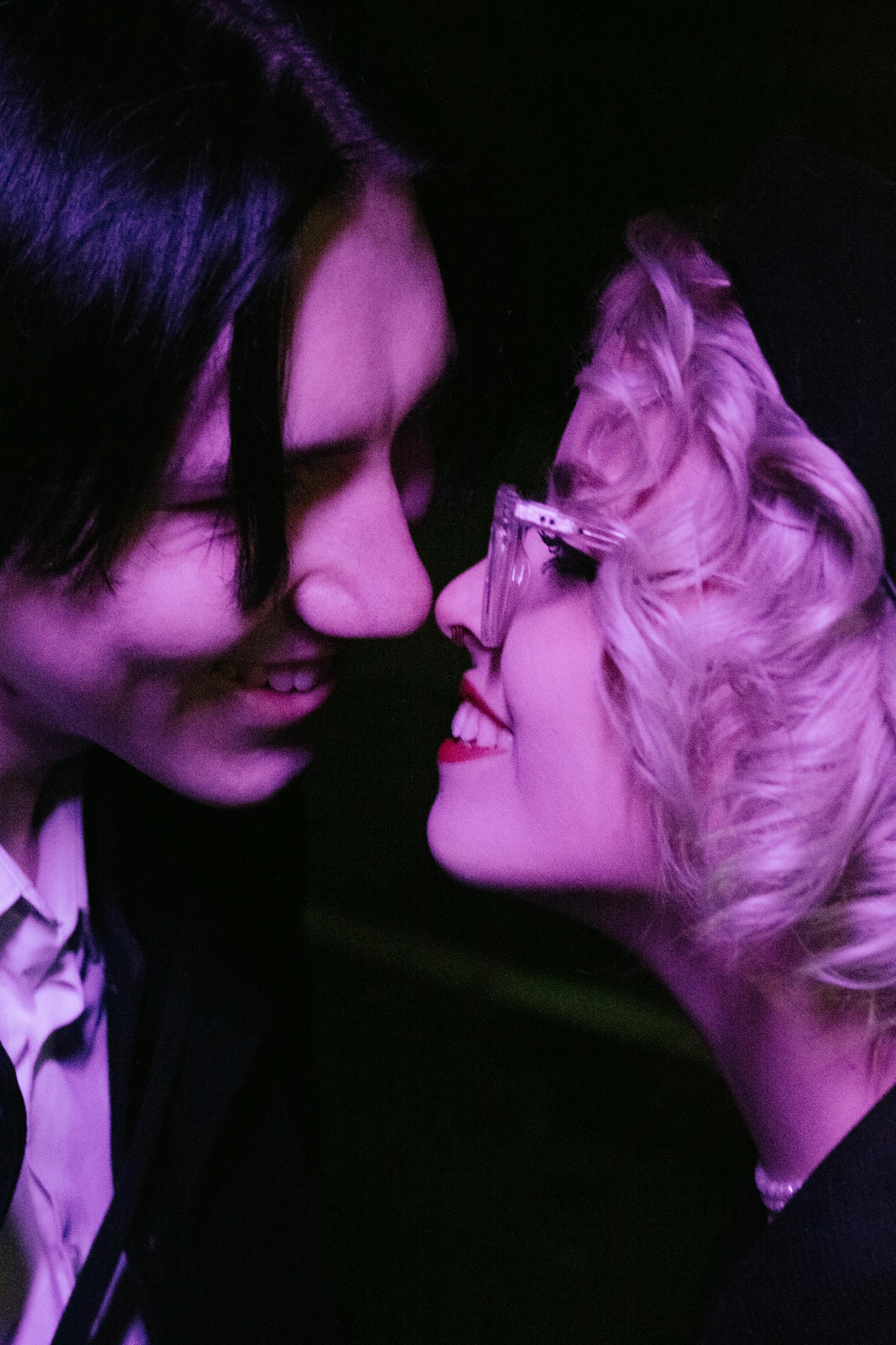 A Woman Putting Her Head on Her Partners Shoulder and Smiling · Free ...