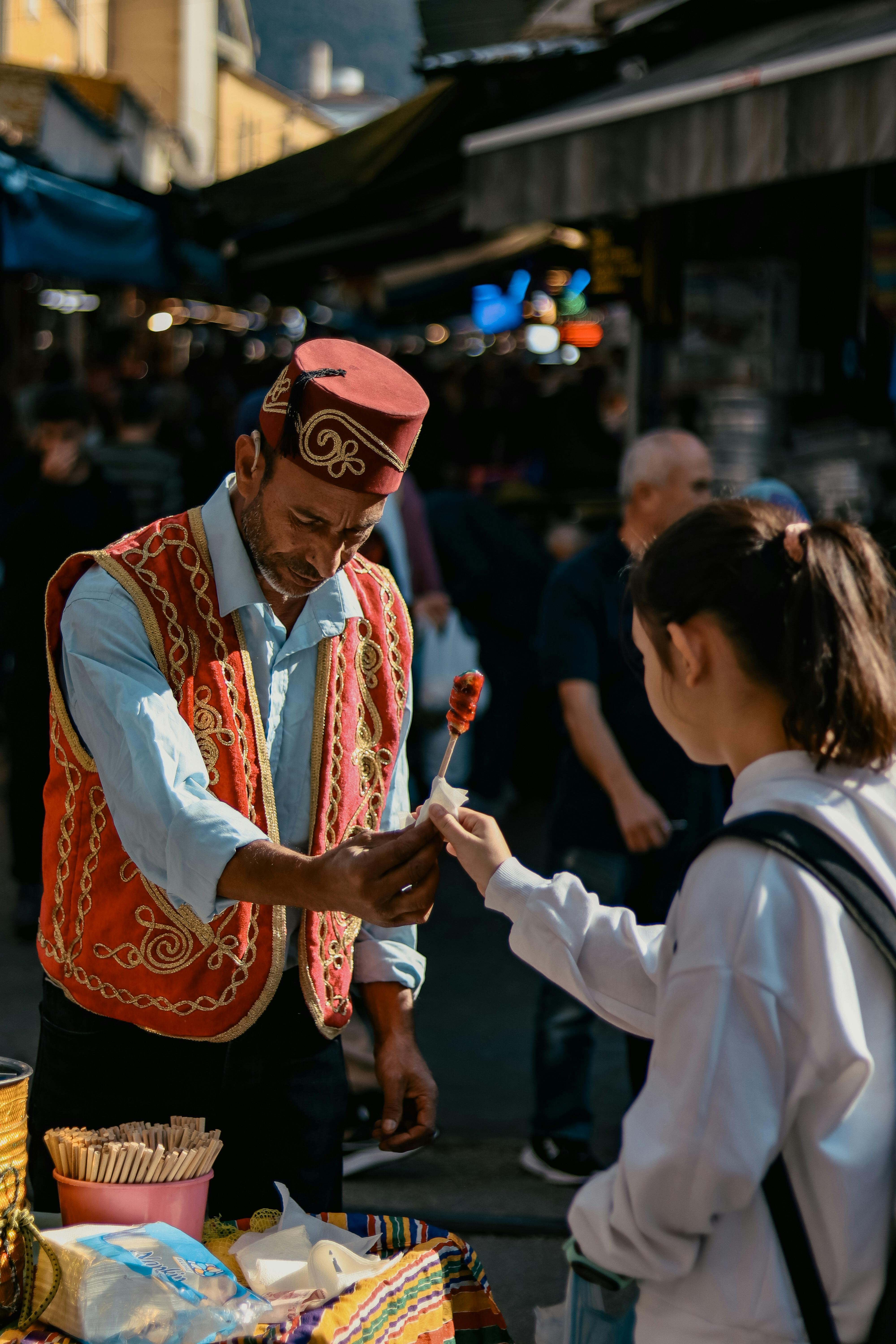 Merchant Selling Snack to Girl · Free Stock Photo