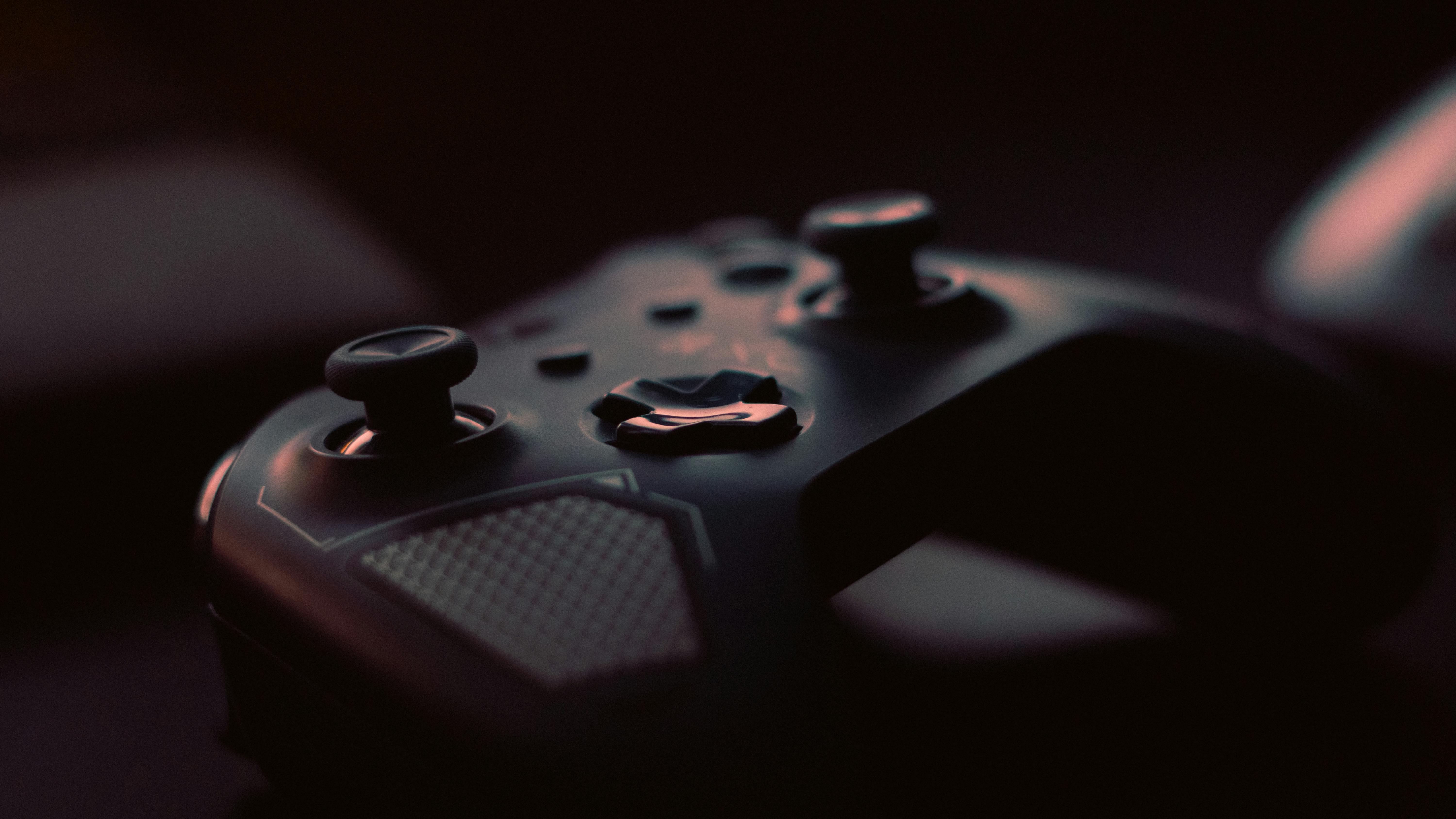 White Gaming Console on Wooden Surface · Free Stock Photo