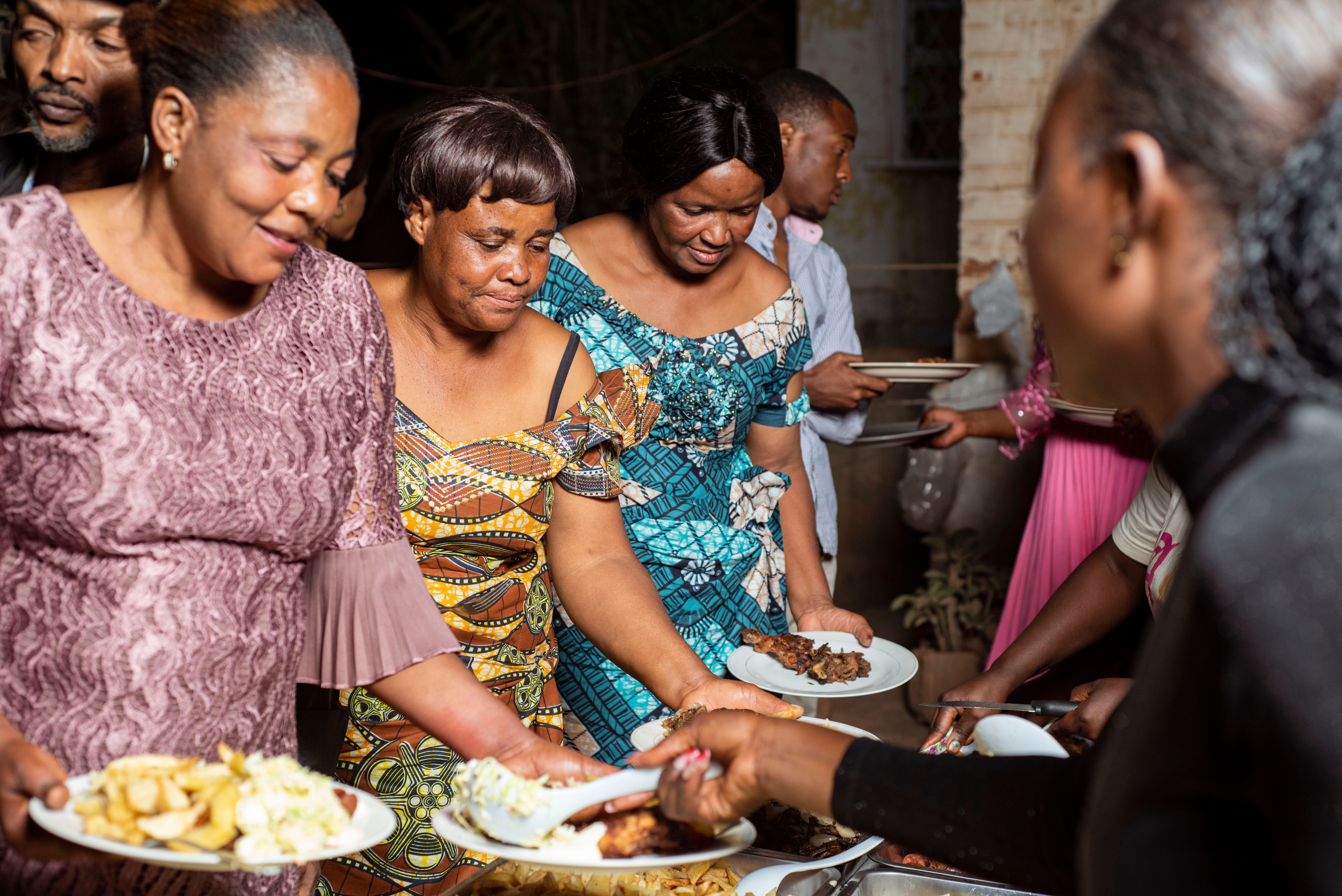 Women Holding Plates with Food · Free Stock Photo
