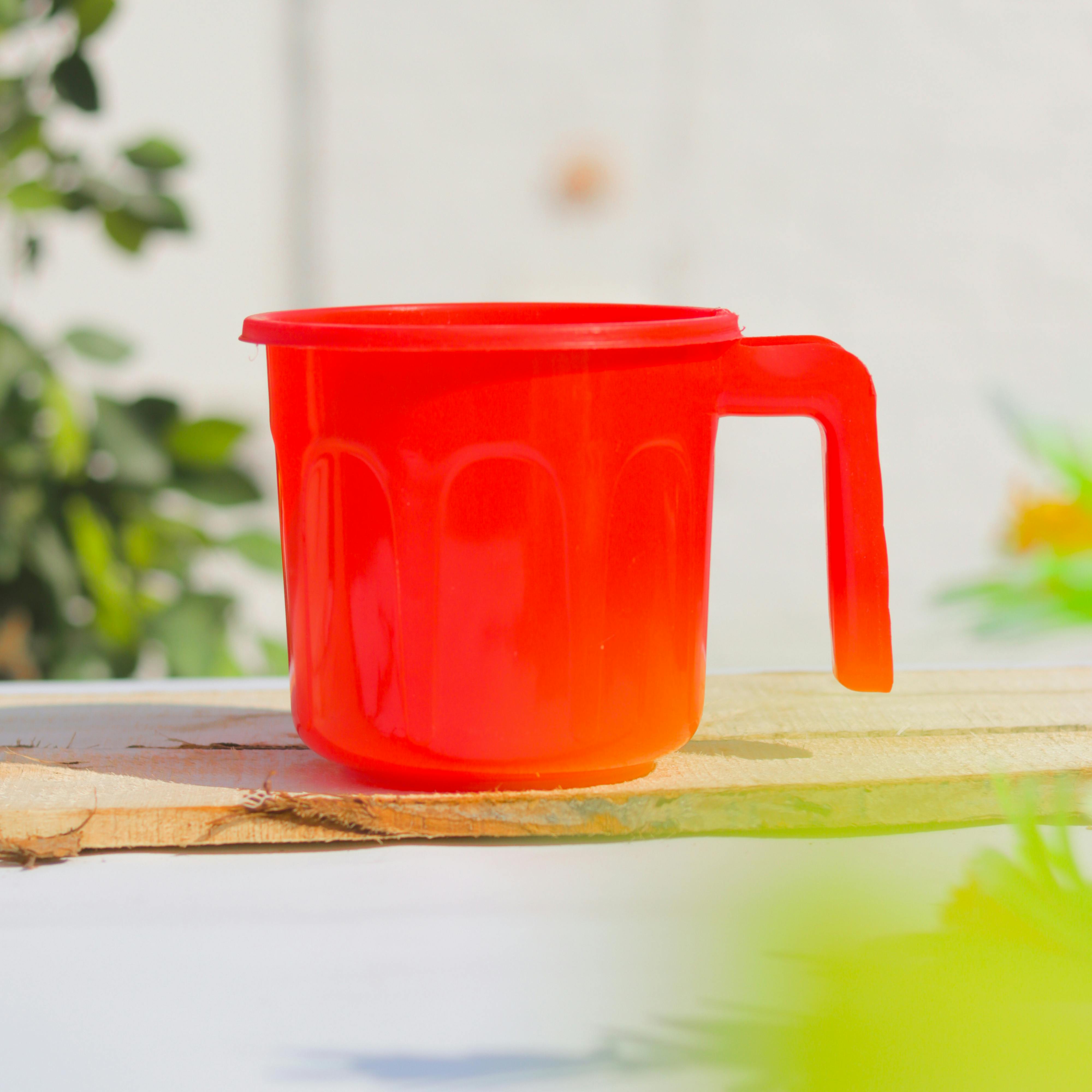 Close-Up Photo of Red Plastic Pitcher · Free Stock Photo