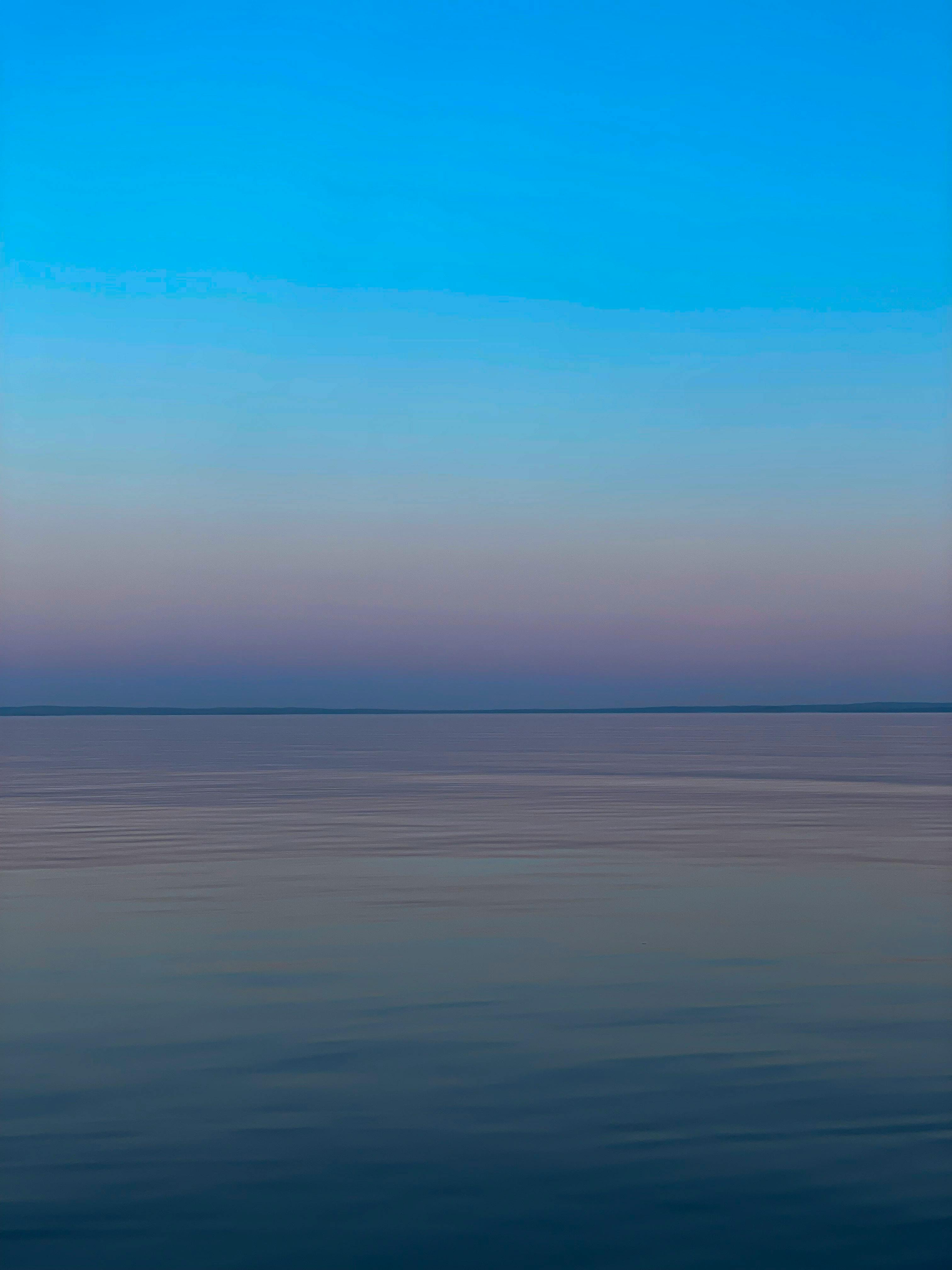 Blue Sky Over Water · Free Stock Photo