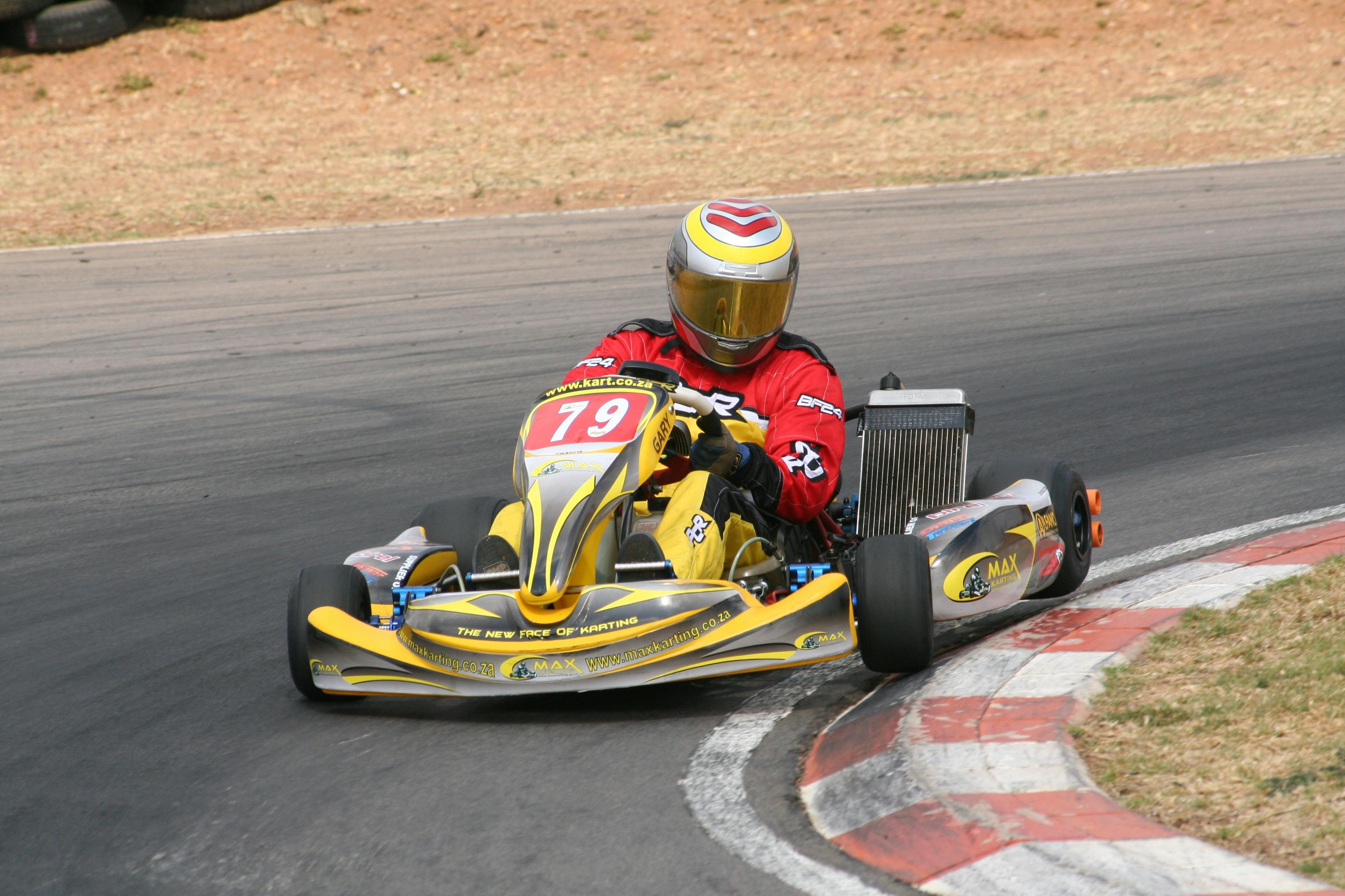 Two Motorcycle Racers Standing in Front of Motorcycles · Free Stock Photo