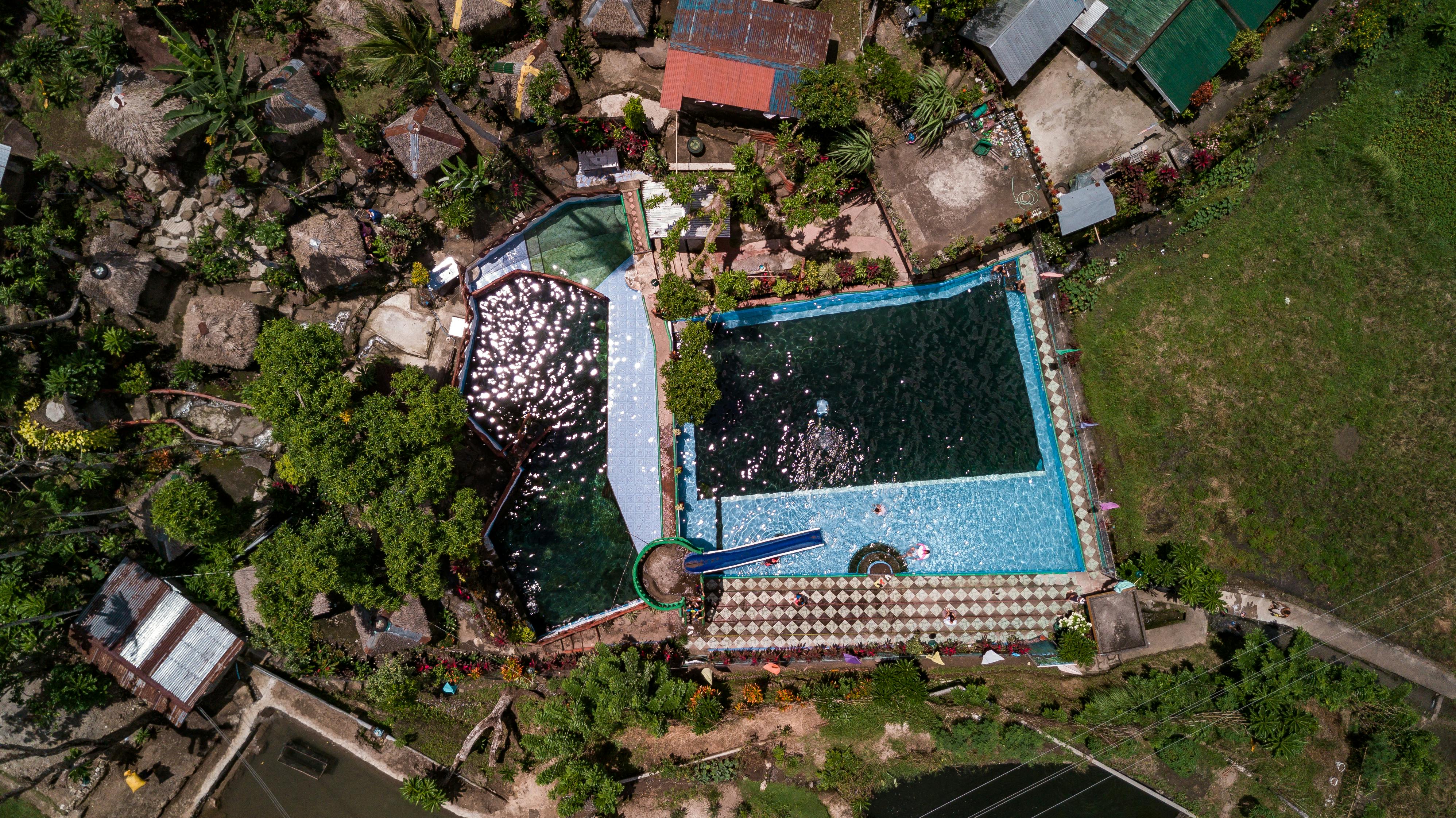 Aerial Shots of Swimming Pools in a Garden · Free Stock Photo