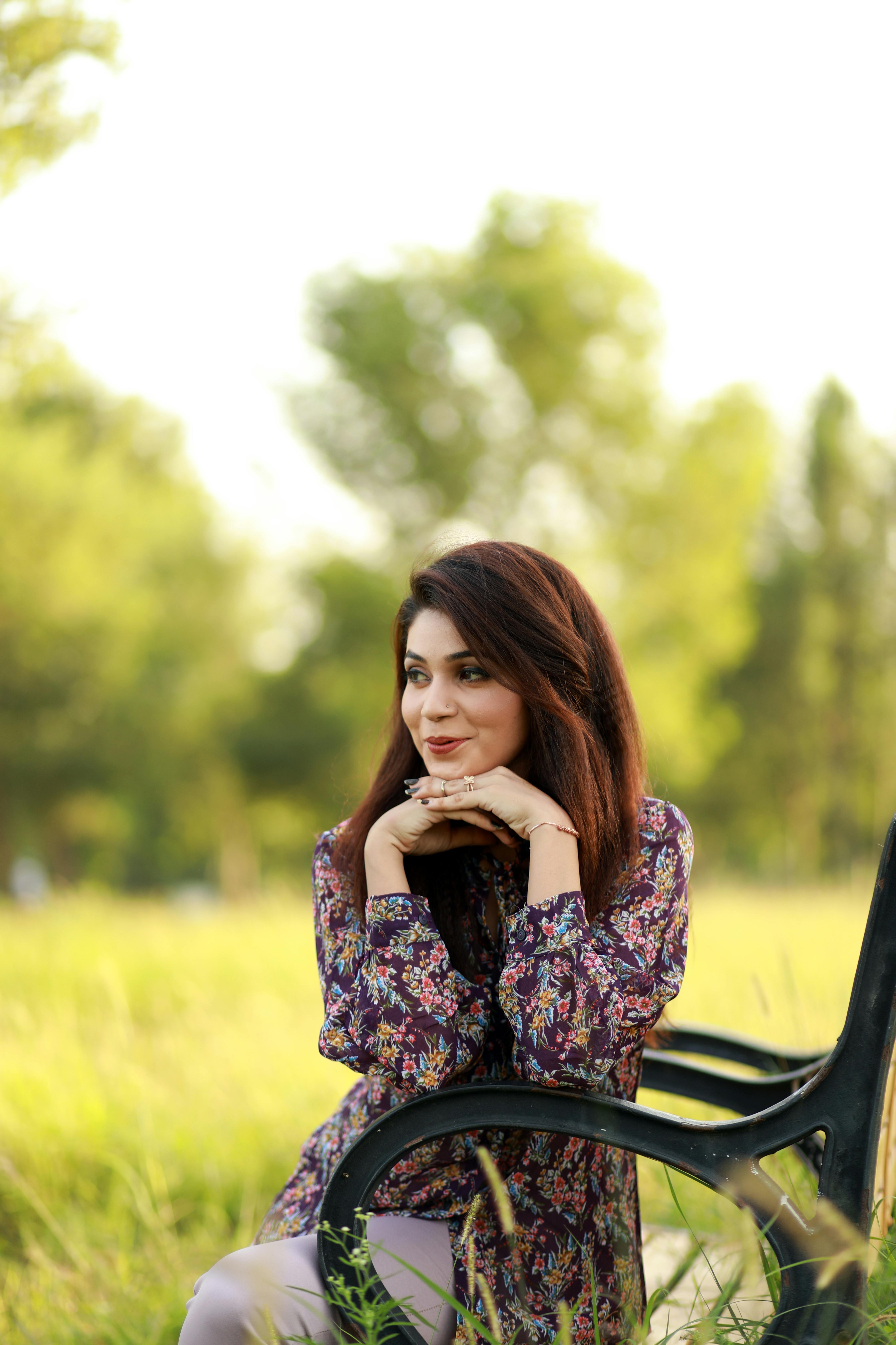 Women Sitting on Bench in Park in Town · Free Stock Photo