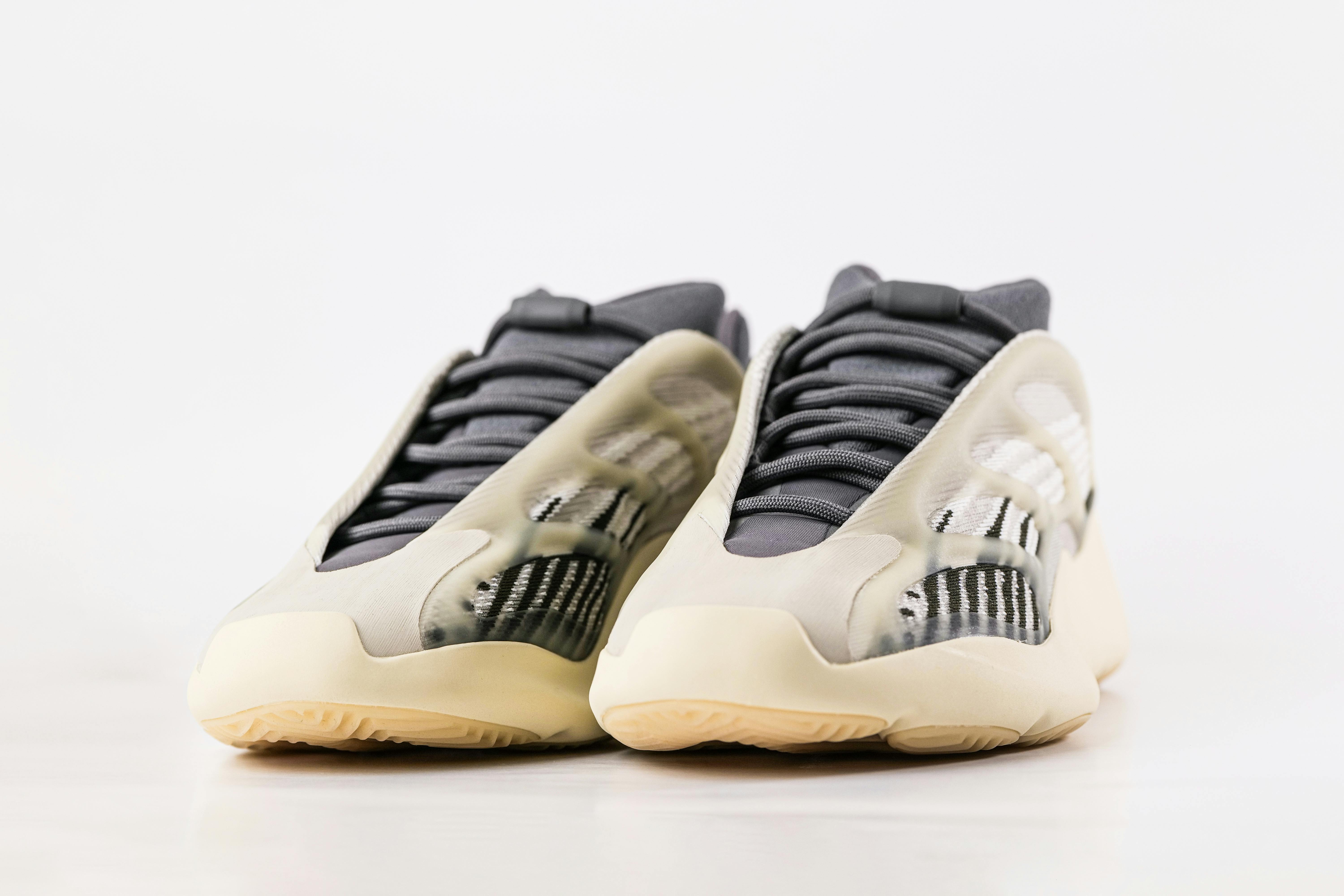 Close-Up Shot of Rubber Shoes on White Surface · Free Stock Photo