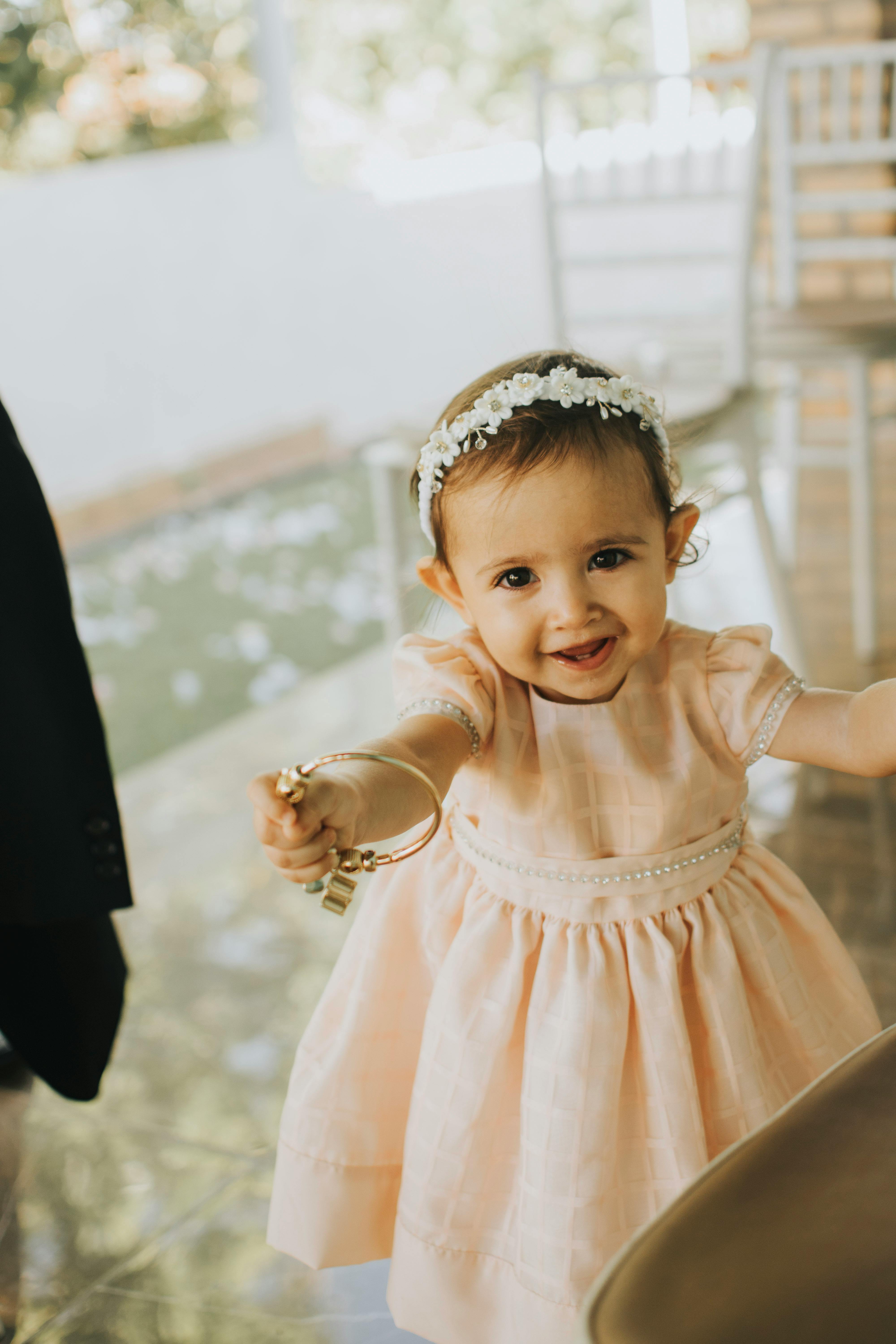 Little Girl in White Summer Dress Standing in a Blooming Sweet Onion ...