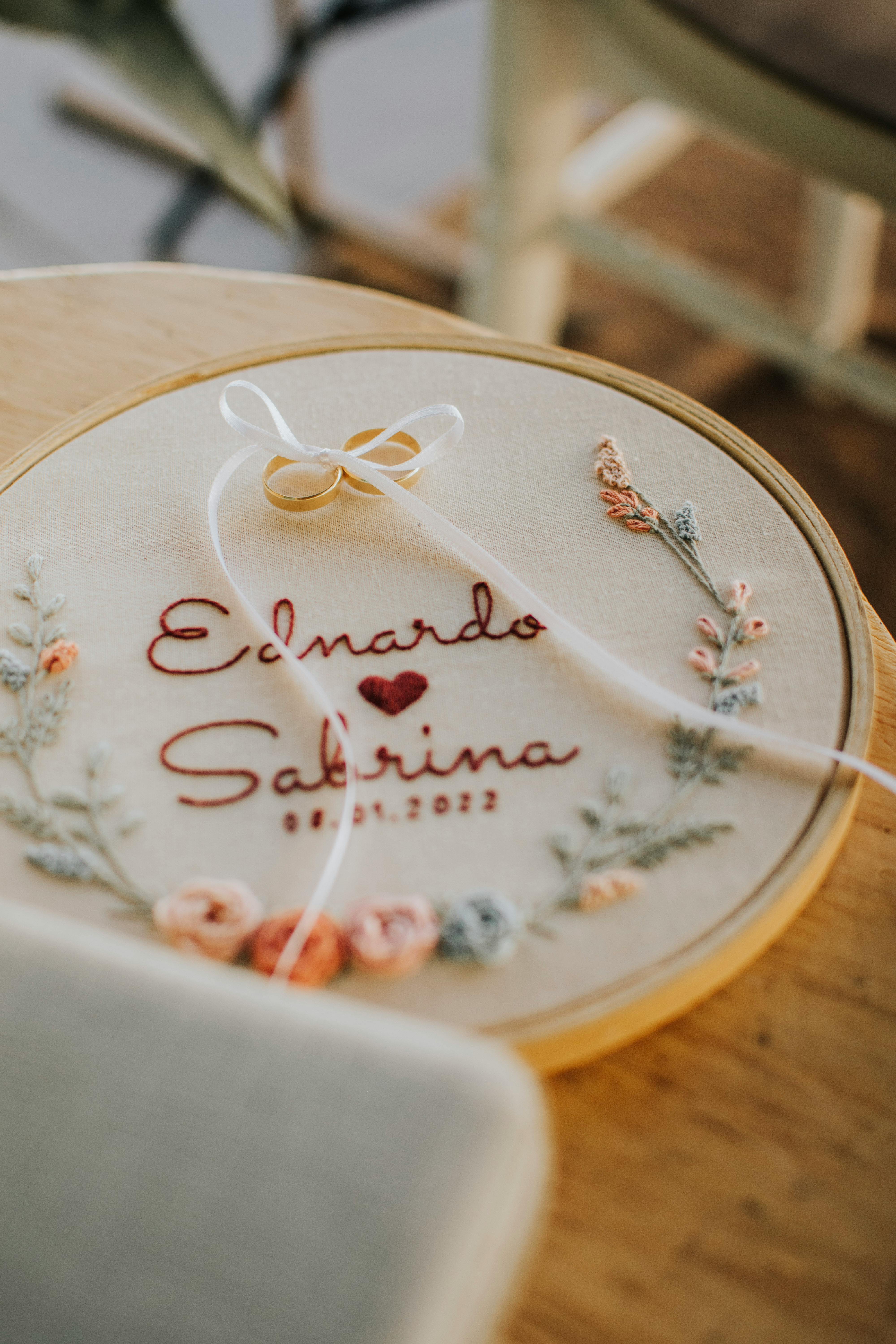 Engagement Rings and Embroidered Names of a Couple · Free Stock Photo