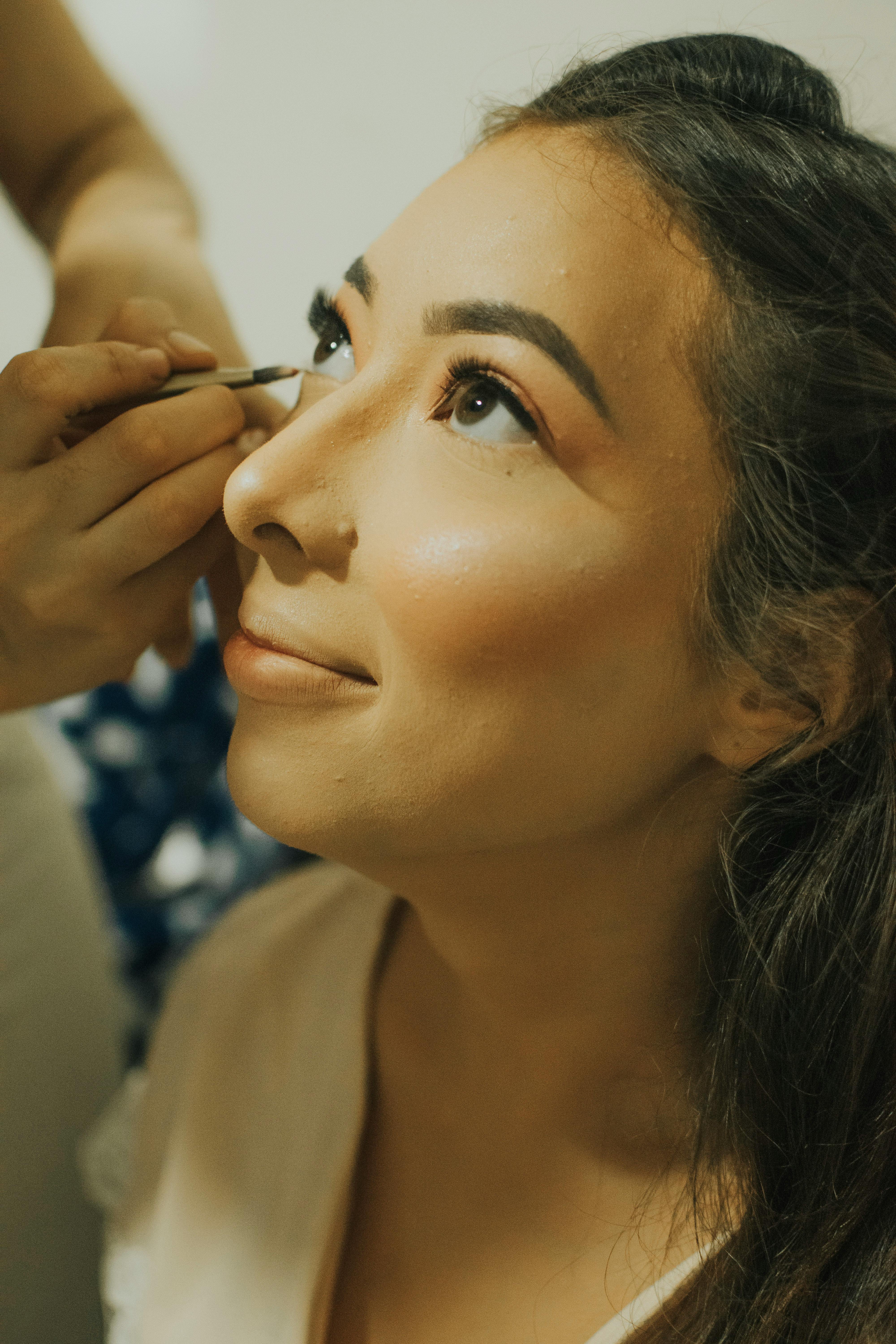 Woman Getting Her Makeup Done · Free Stock Photo