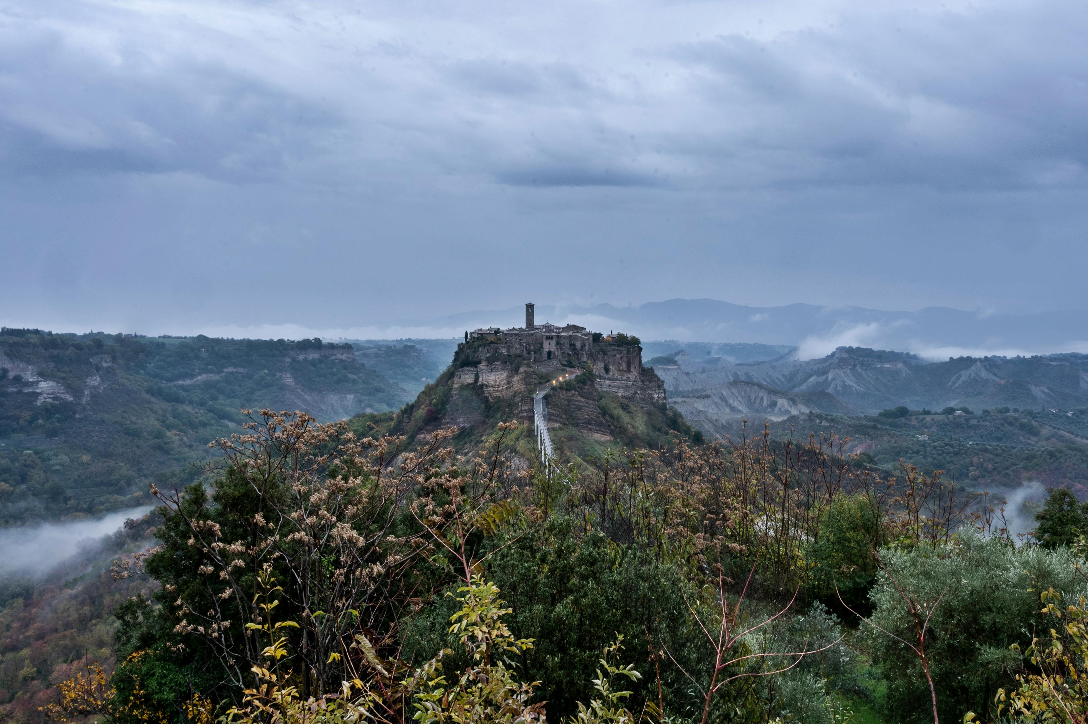 An Old Stone Structure on Top of a Mountain Under Blue Sky · Free Stock ...