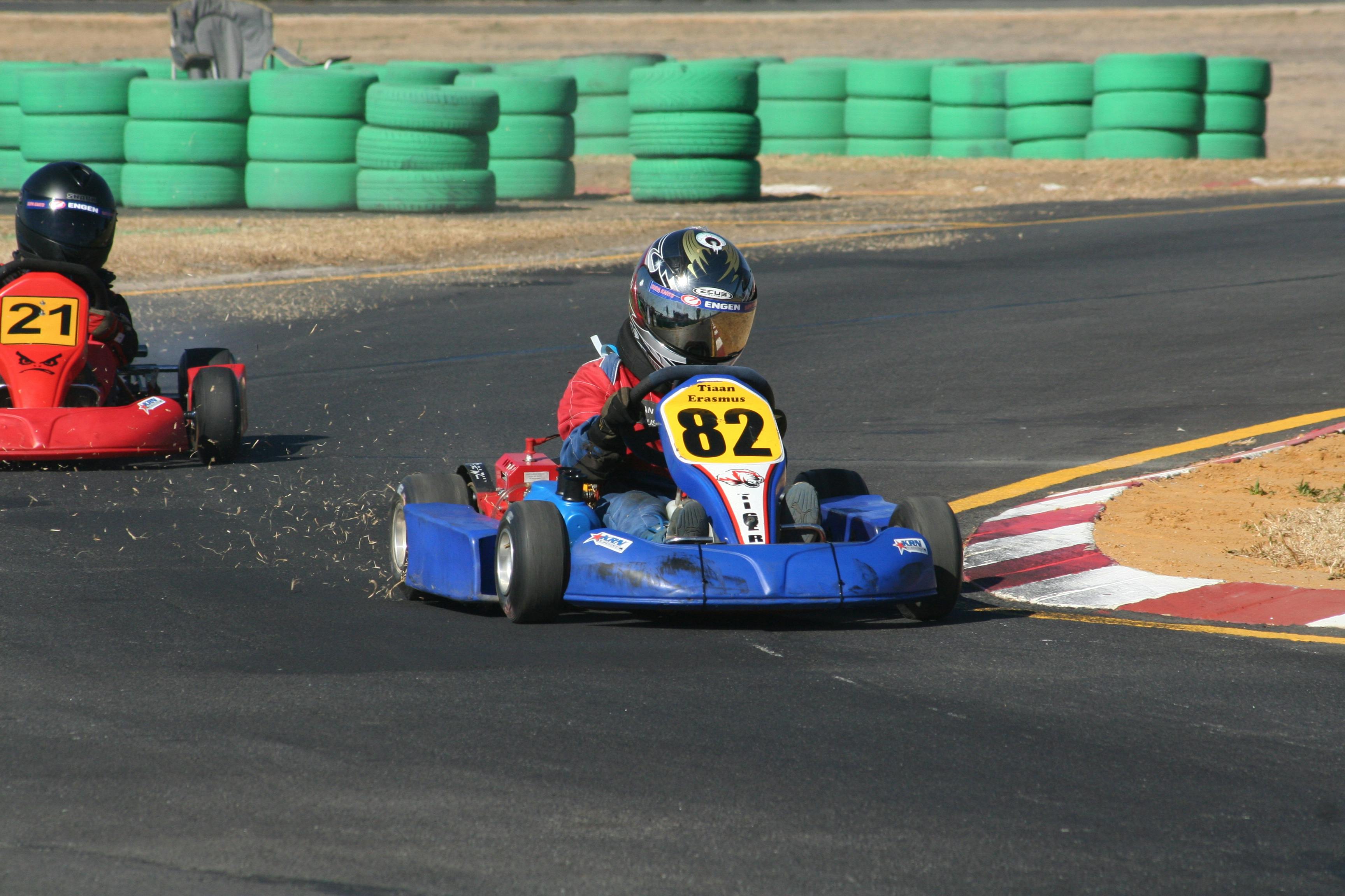 Drivers Racing in Go Karts on a Circuit · Free Stock Photo
