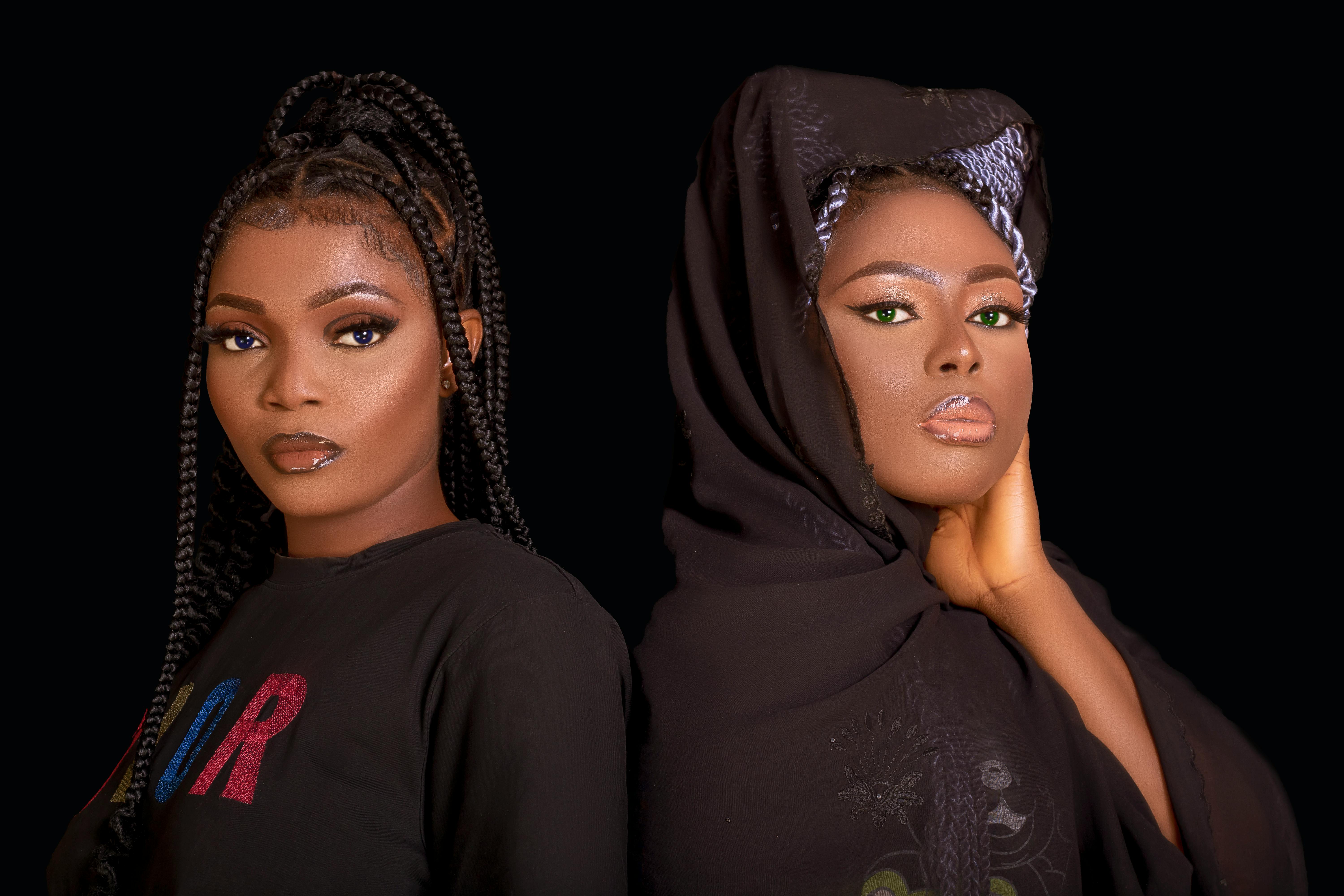 Young Woman in a Hijab Holding a Fabric Fan to Cover Half of Her Face ...