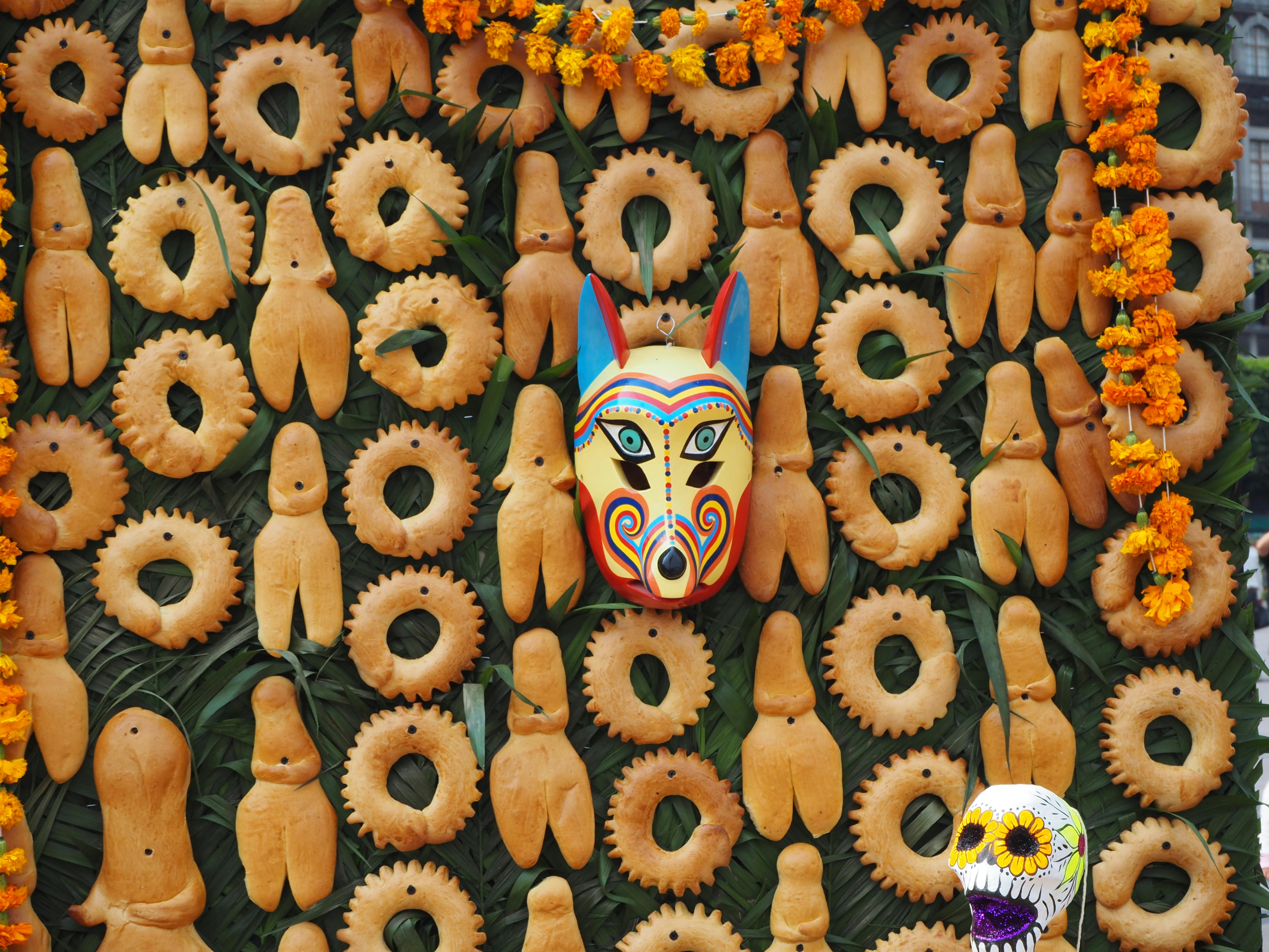 Colorful Wooden Mask Lying among Baked Bread Cookies · Free Stock Photo