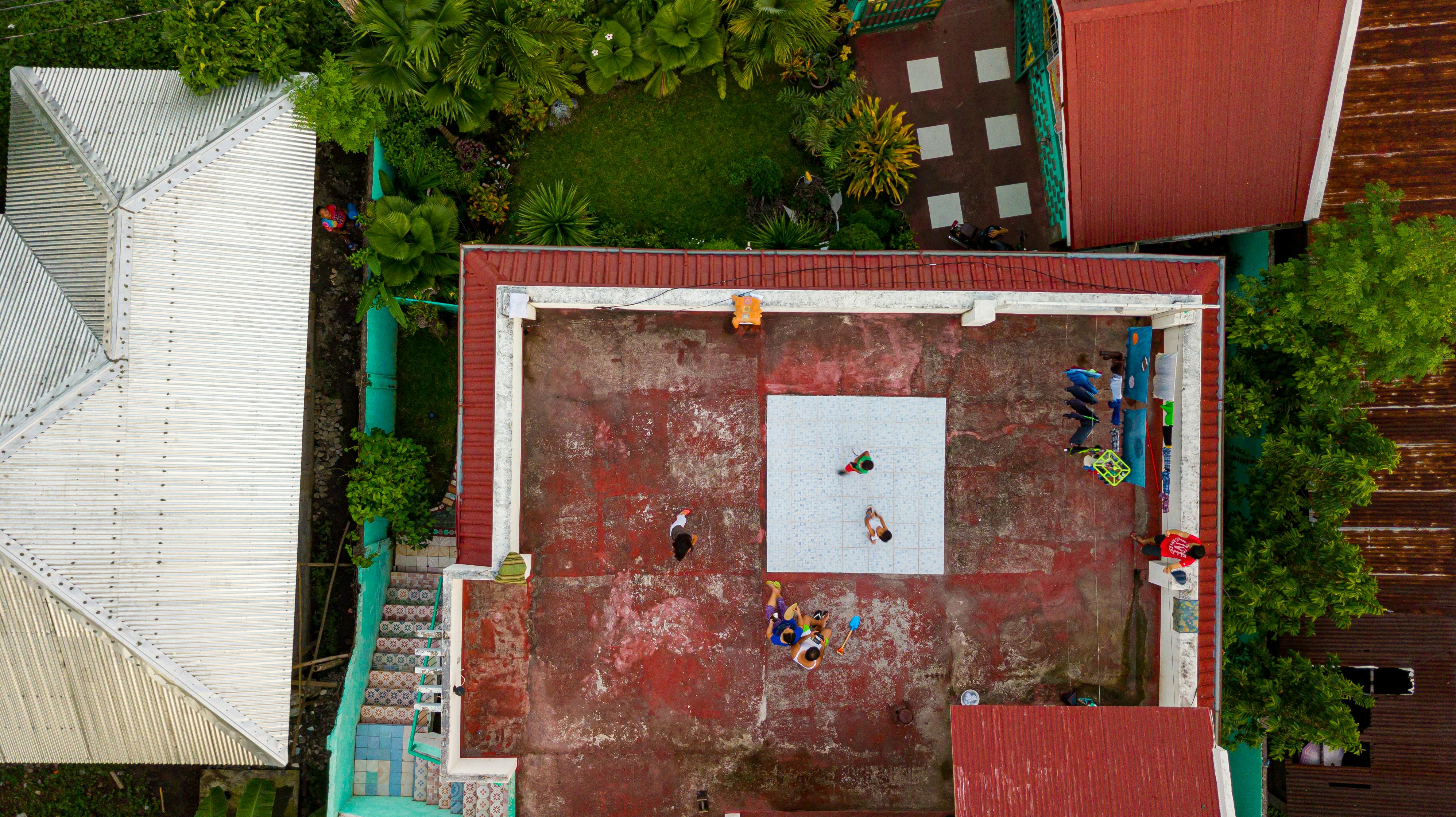 People Standing on a Rooftop of a Building · Free Stock Photo