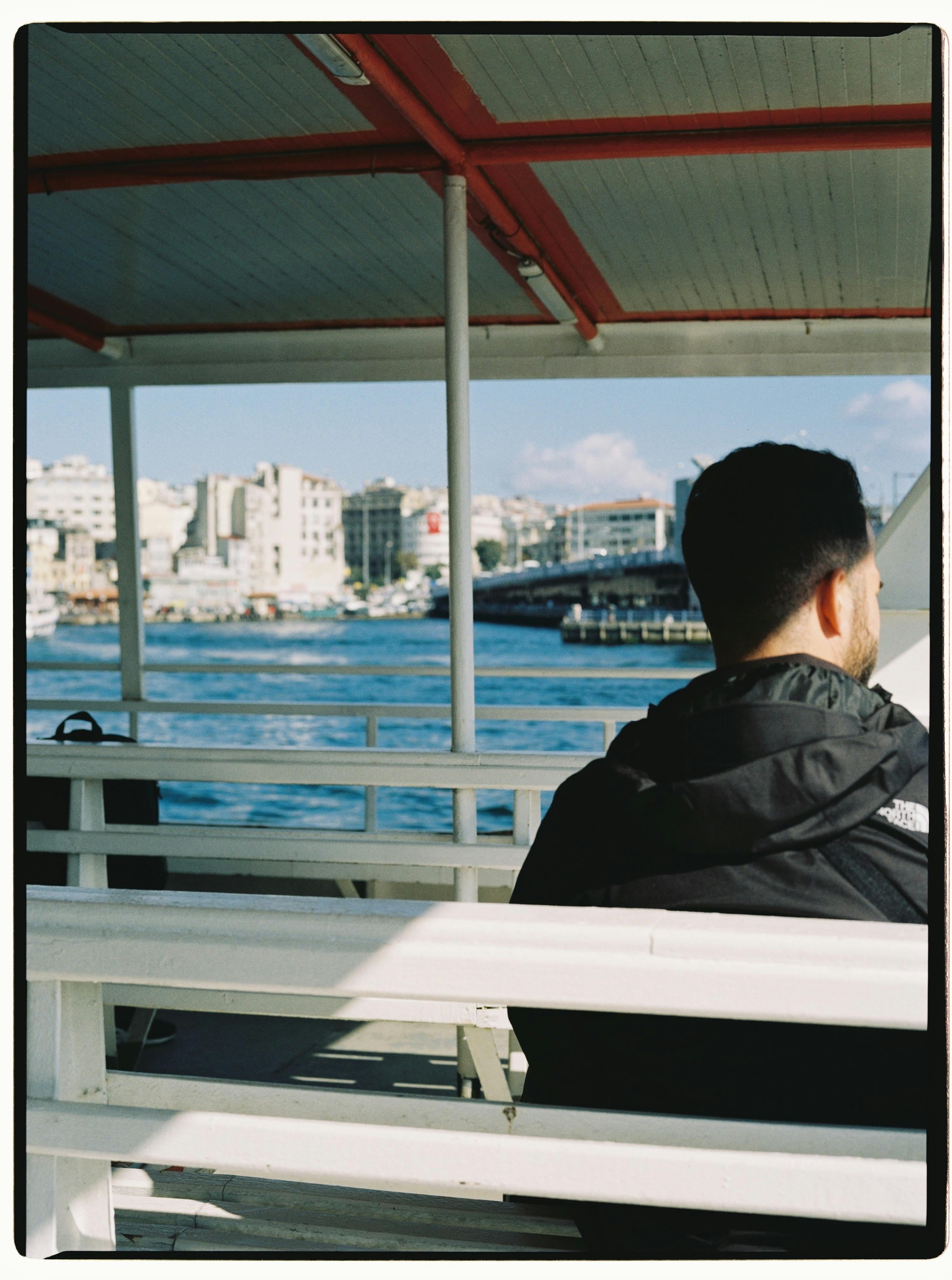 Back View of a Man on a Ferry Boat · Free Stock Photo