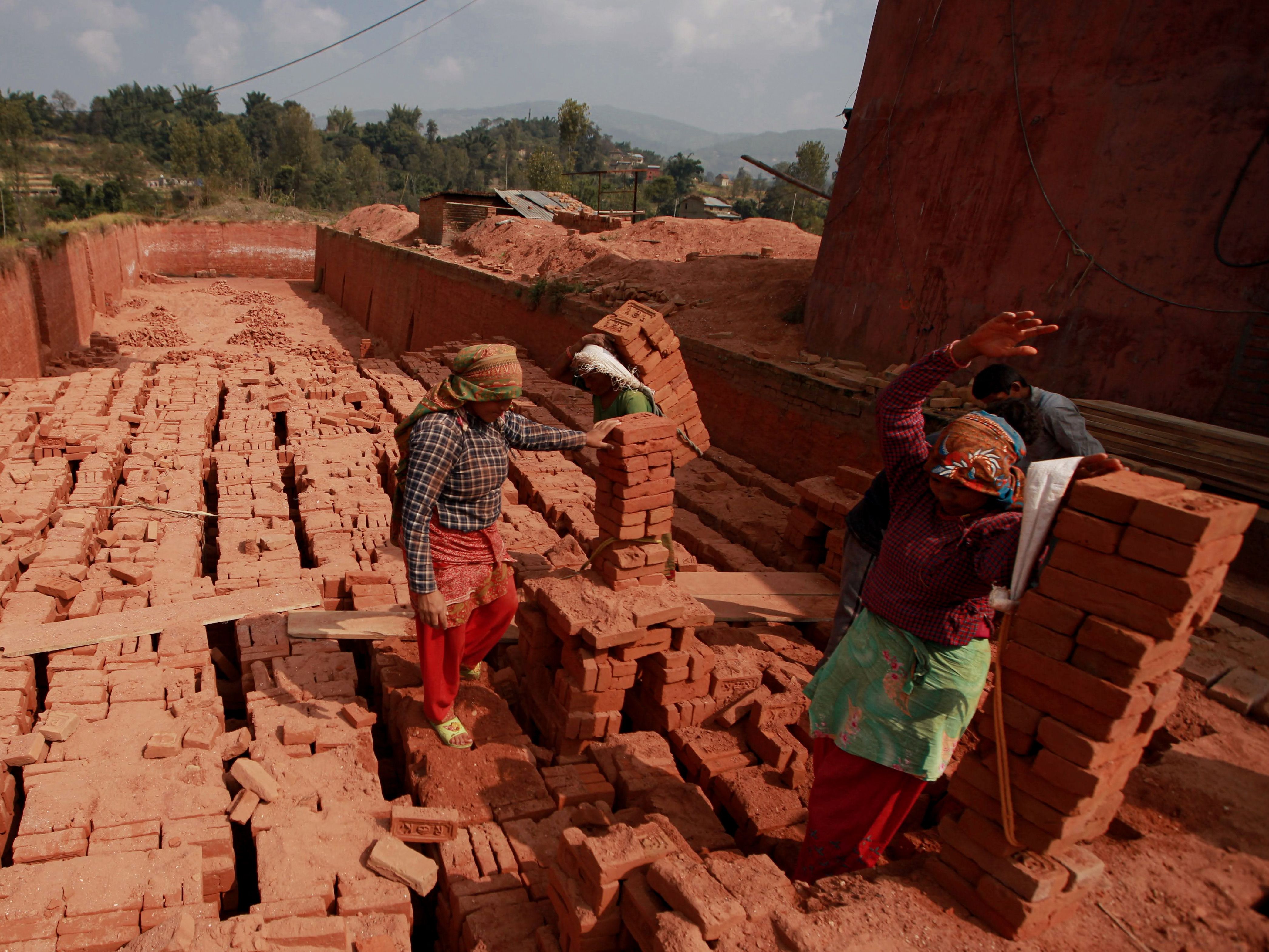 Women Working with Brick at Building Site · Free Stock Photo