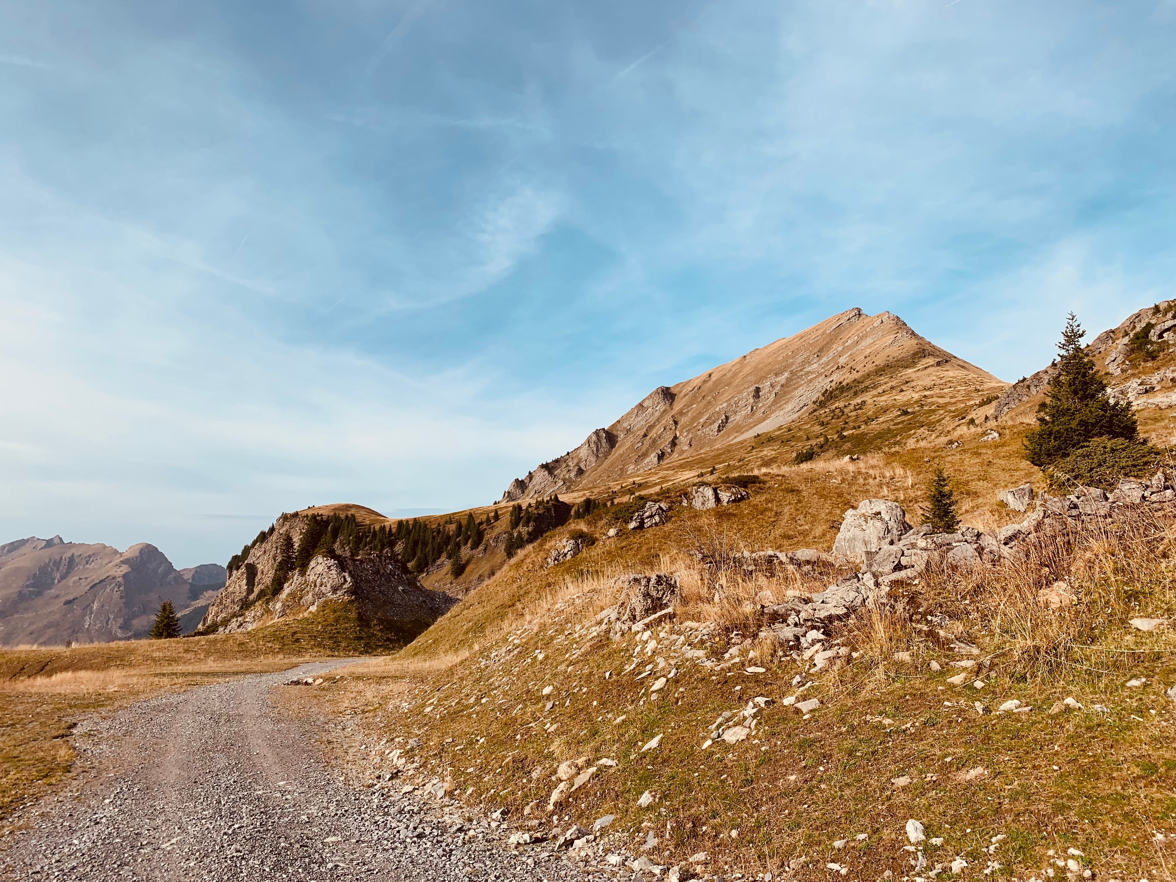 An Unpaved Pathway Near the Mountains Under the Cloudy Sky · Free Stock ...