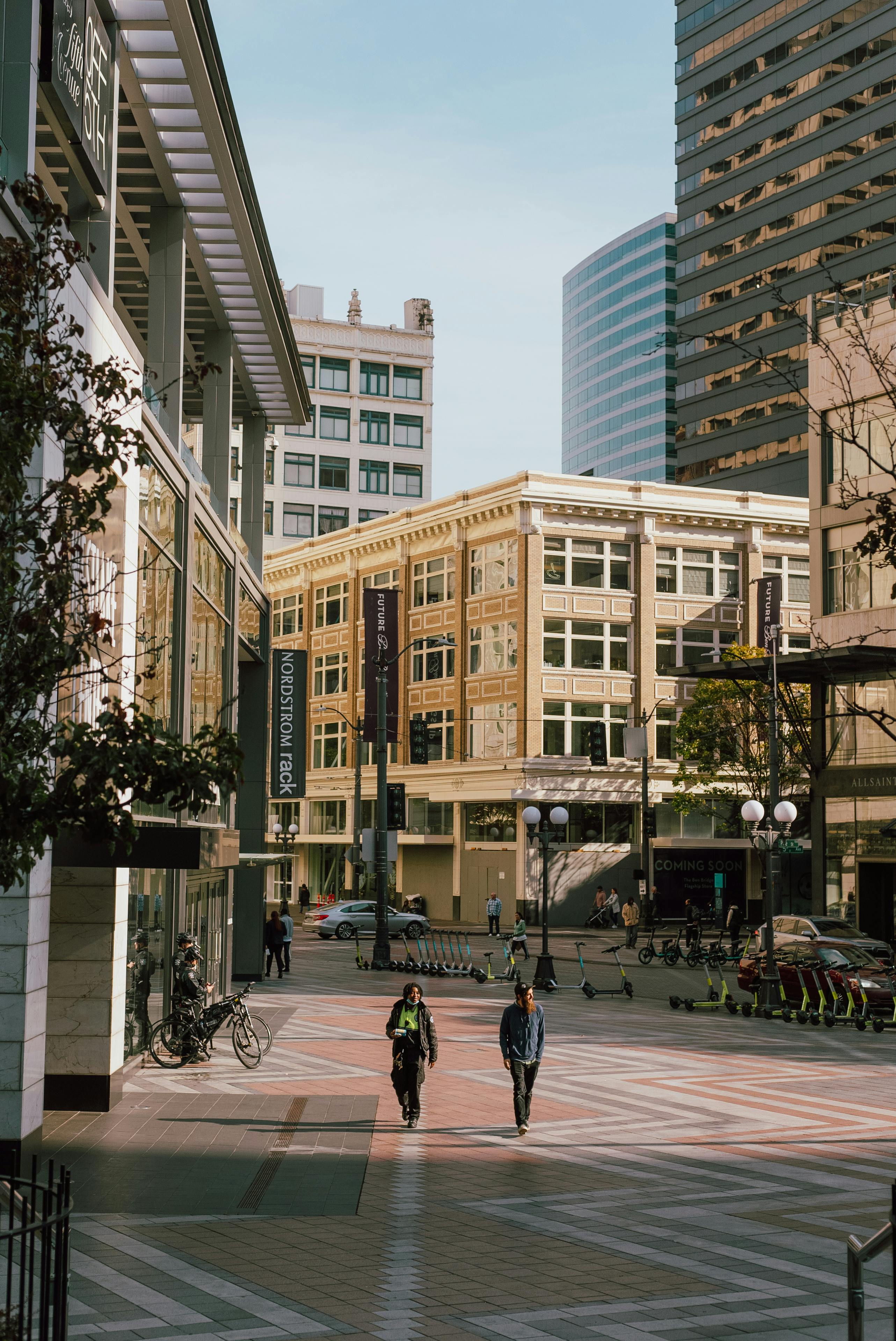 People Walking on Street Near Buildings · Free Stock Photo