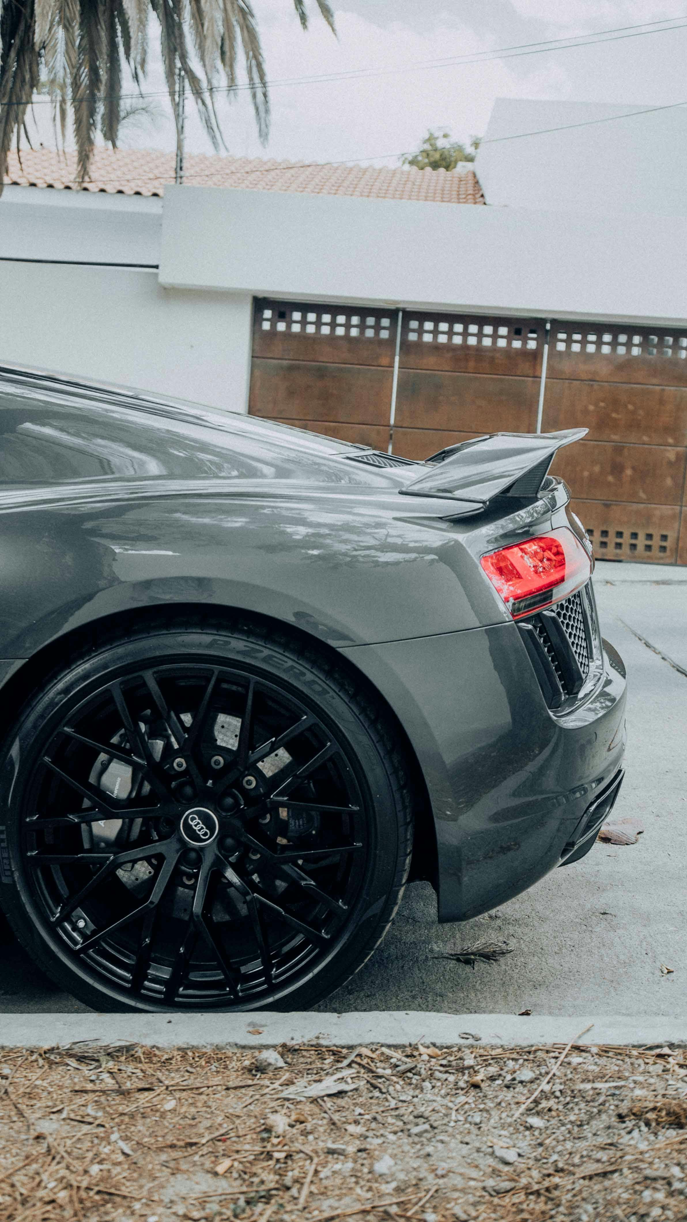 Gray Car with Black Wheel and Spoiler Parked on Concrete Pavement ...