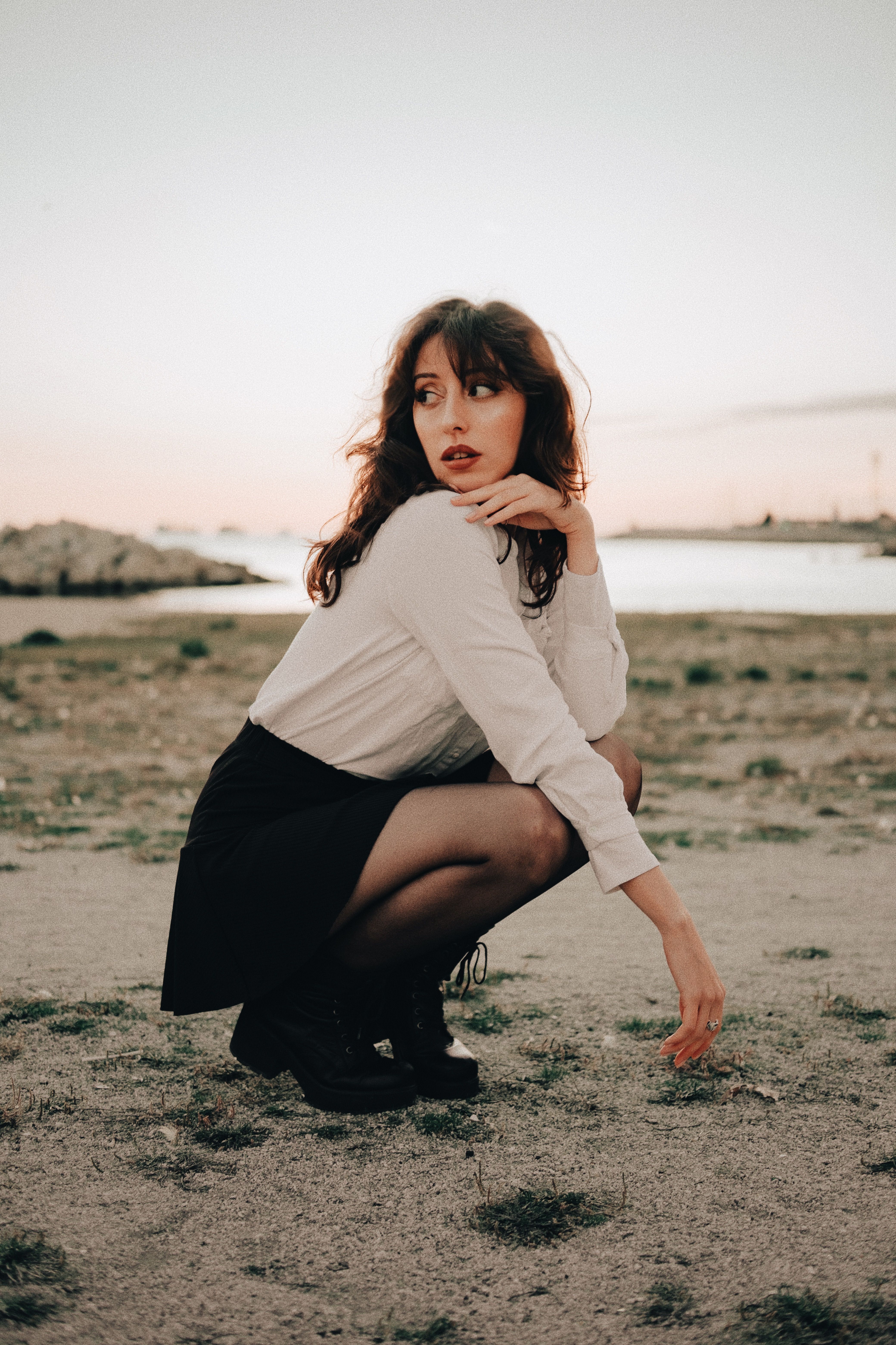 Female Model Posing on One Leg in Front of a Wall · Free Stock Photo