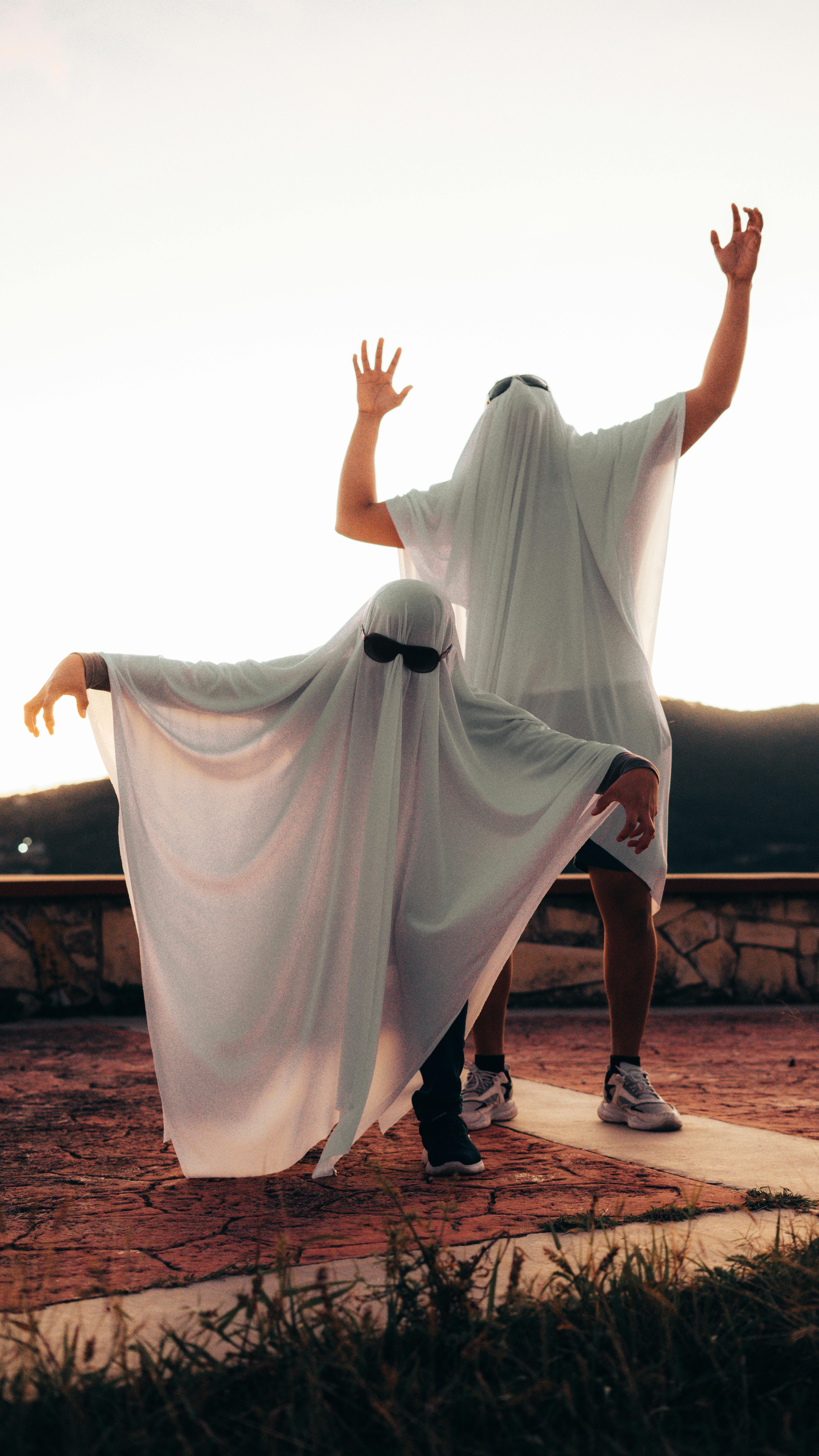 People Covered with White Sheets Dressed as Ghosts in Sunglasses · Free ...