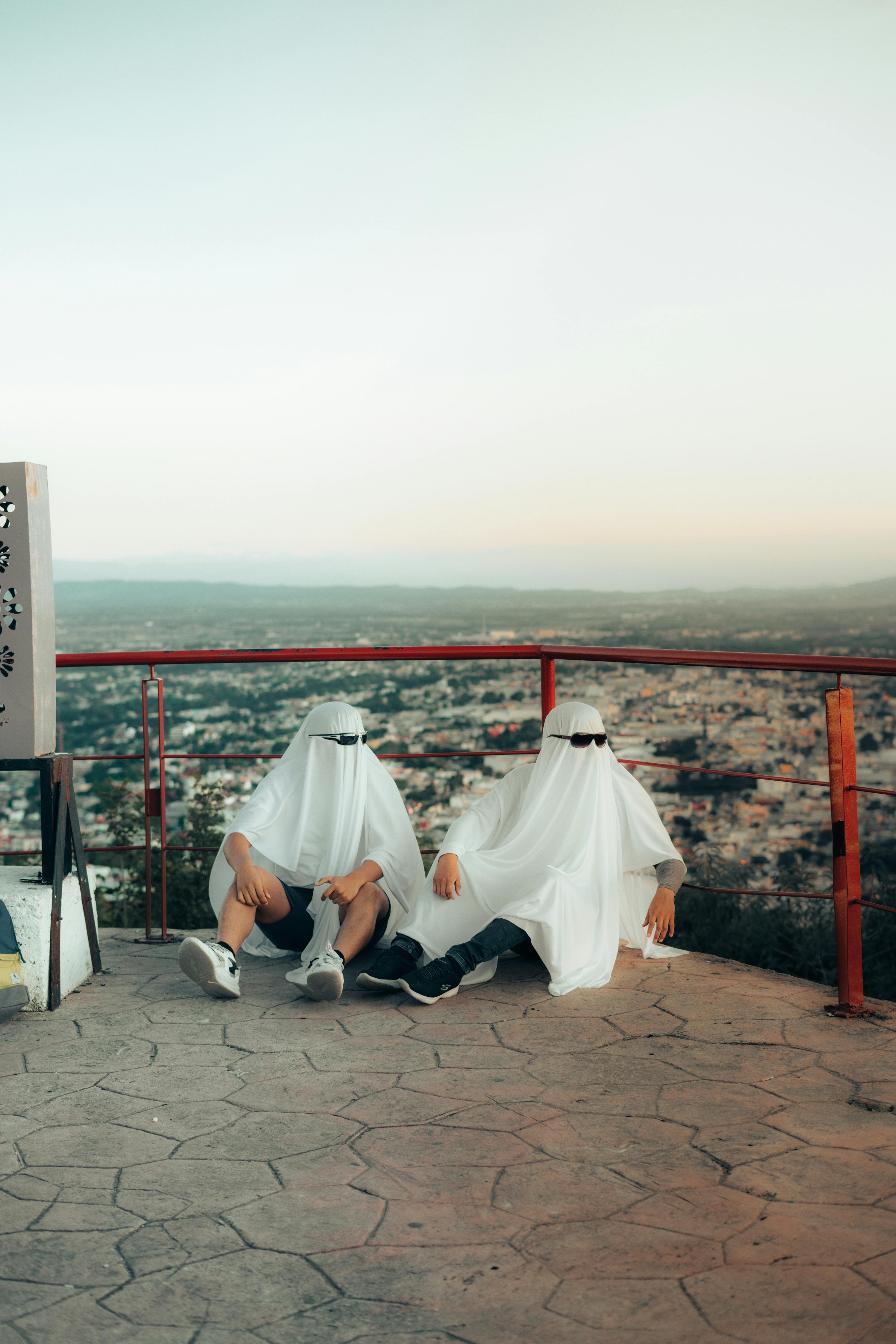 Men Sitting with White Veils on Heads · Free Stock Photo