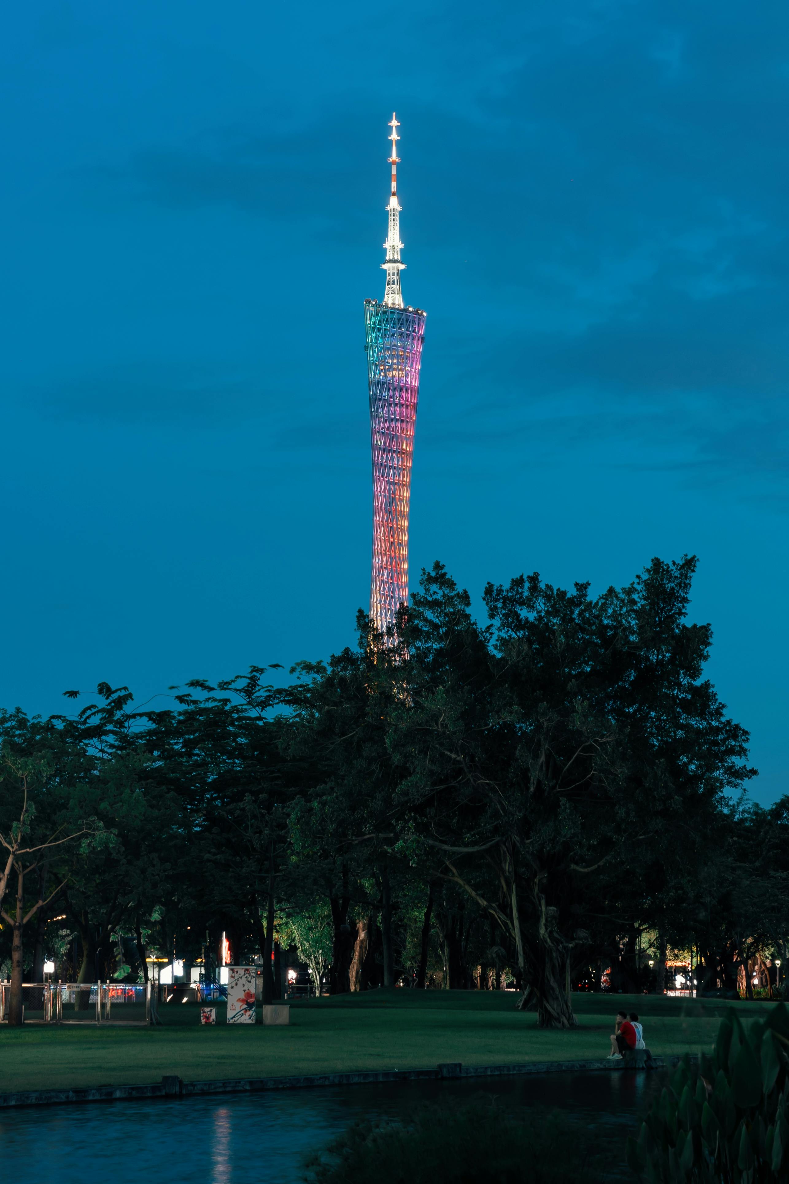 Illuminated Canton Tower seen from a Park at Dusk · Free Stock Photo
