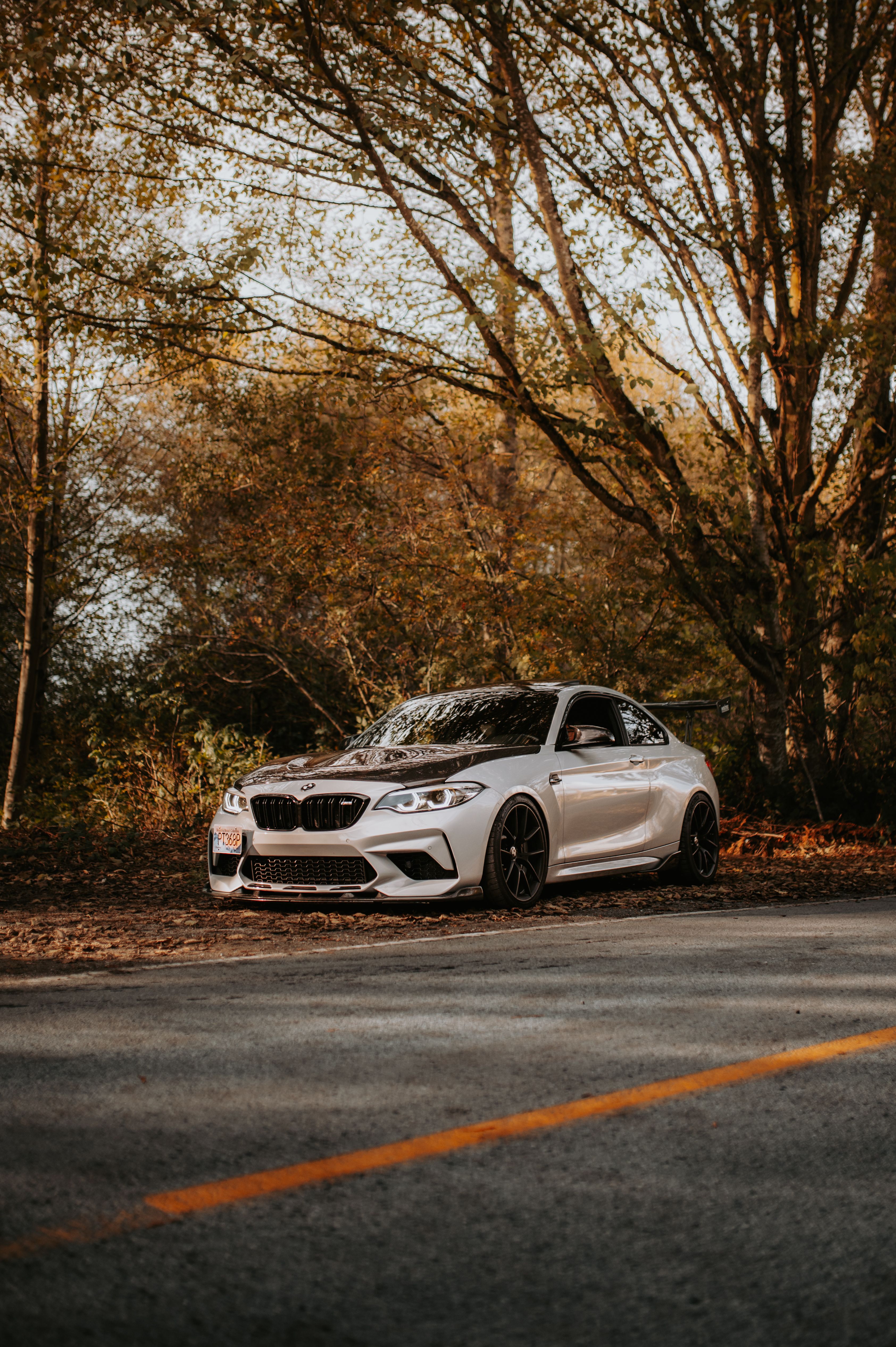 White Coupe Car on the Roadside · Free Stock Photo