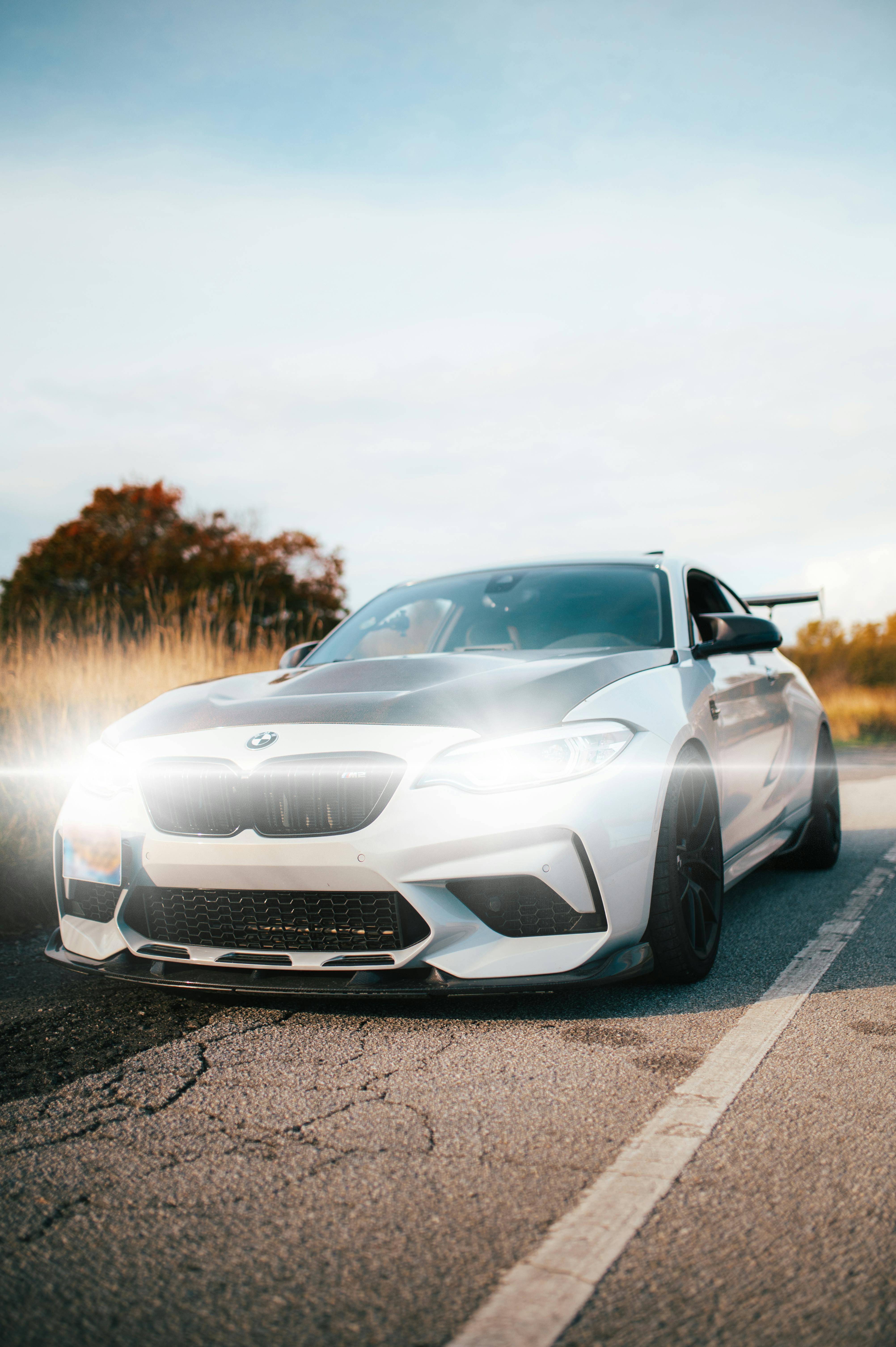 White Luxury Car on Road · Free Stock Photo