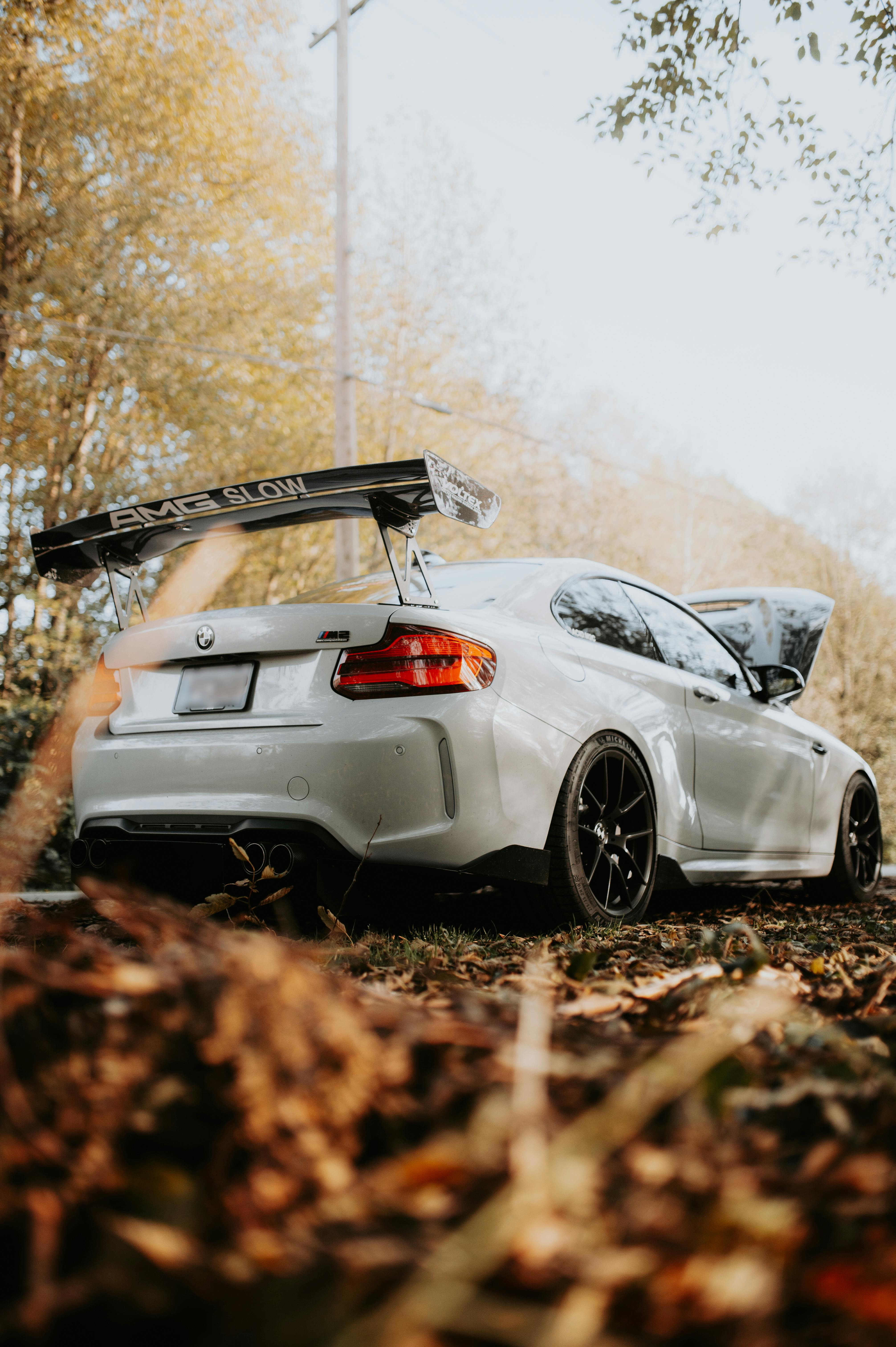White Coupe Car on the Roadside · Free Stock Photo