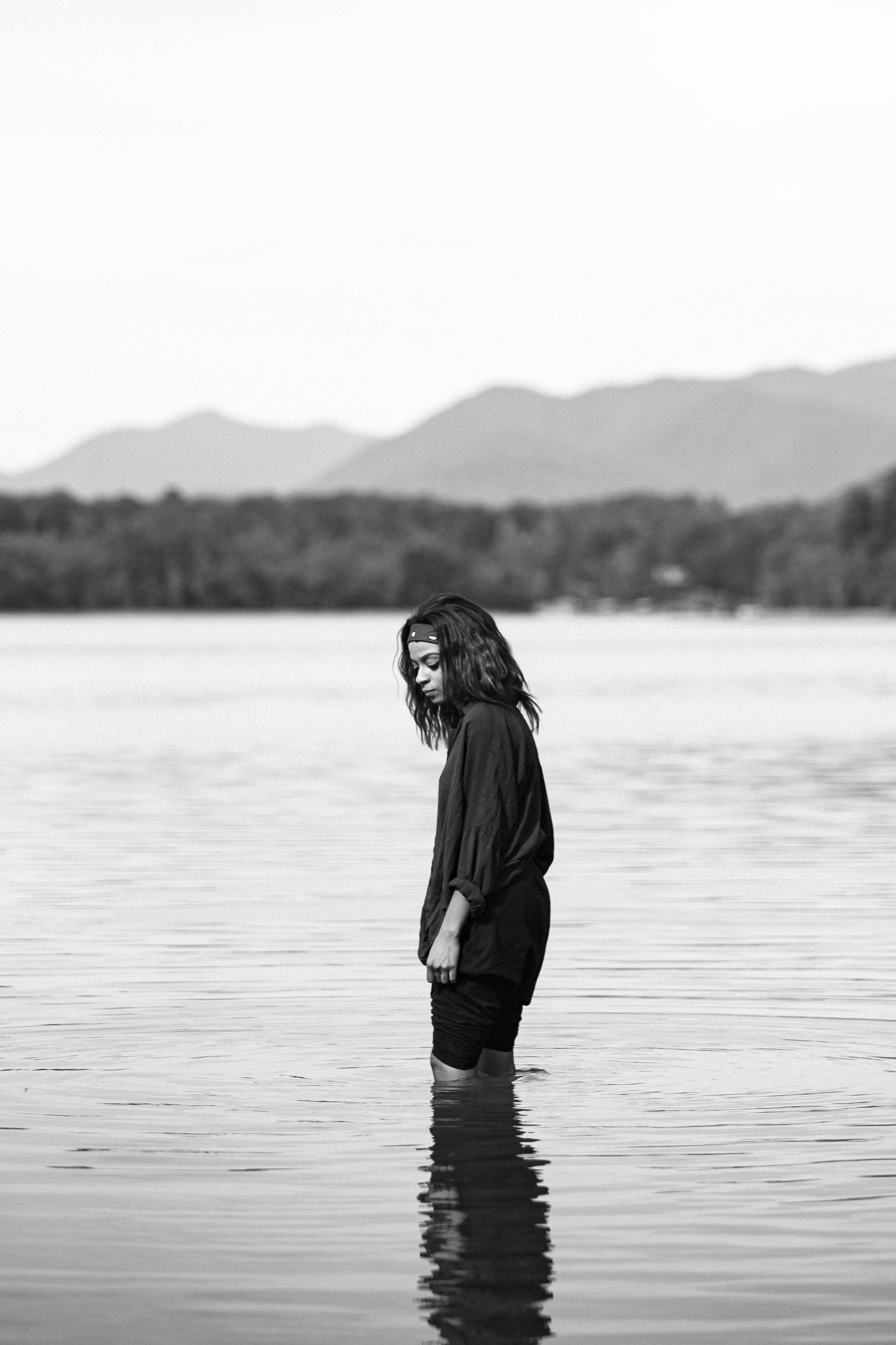 Woman Standing Shallow Water · Free Stock Photo