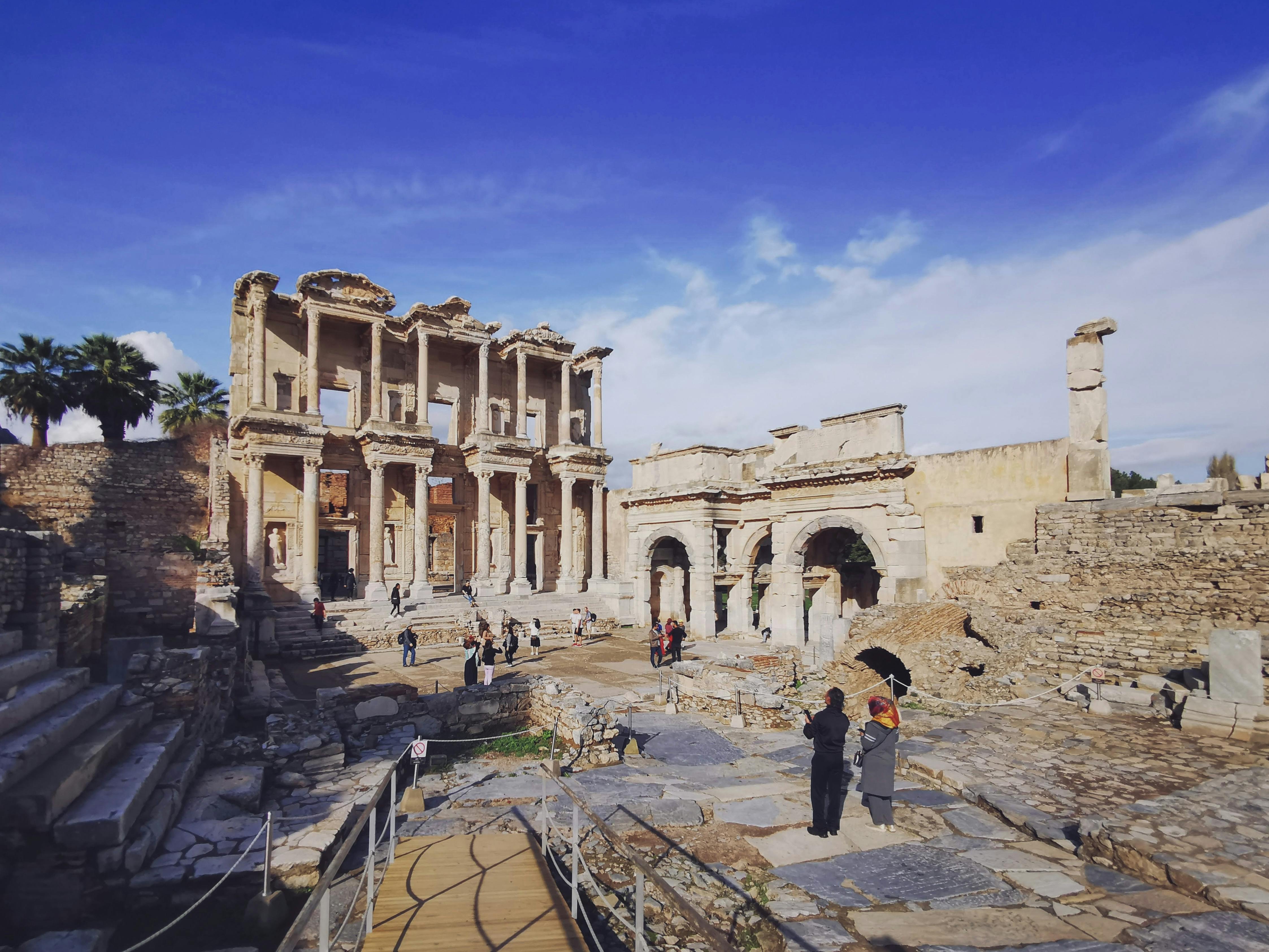 Man Walking in Colonnaded Street · Free Stock Photo